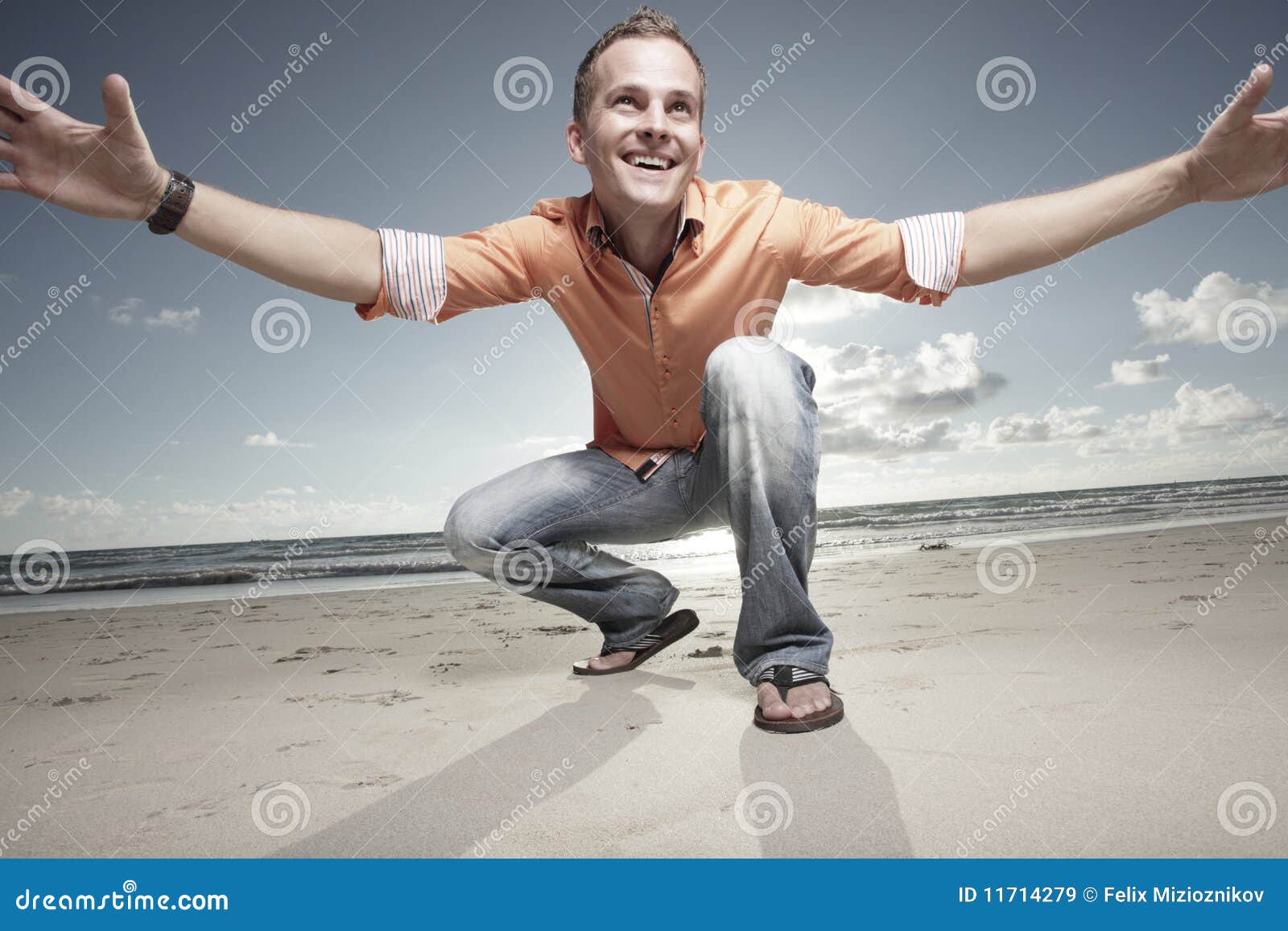 Happy man on the beach stock image. Image of arms, angle - 11714279