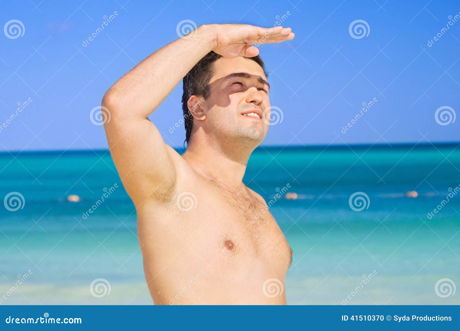 Happy man on the beach stock photo. Image of handsome - 41510370