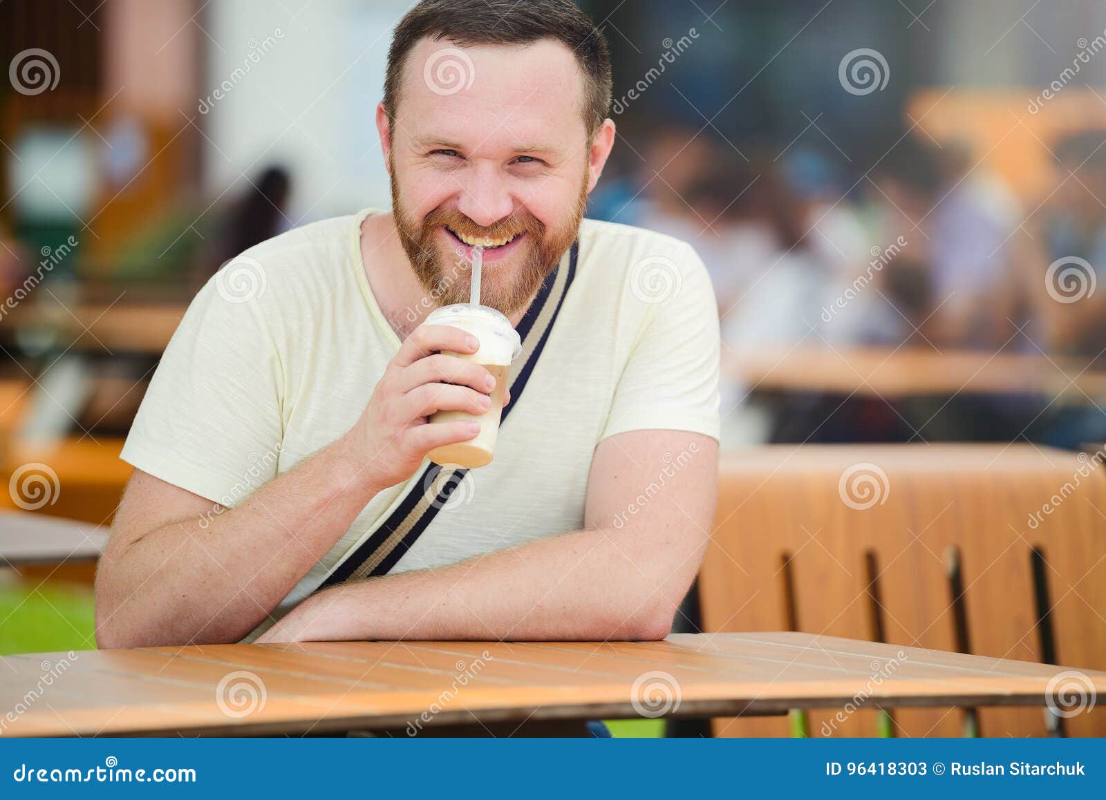 Happy Man with a Beard Drinking a Soft Drink in the City Smiling, Cold ...