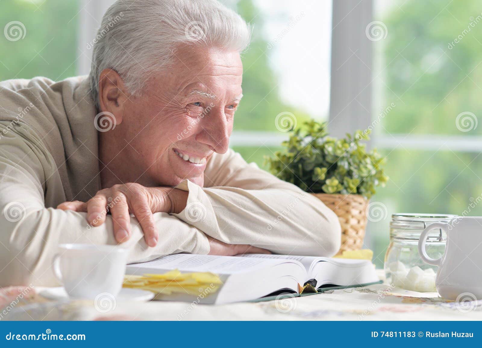 Happy man with book stock image. Image of elderly, face - 74811183