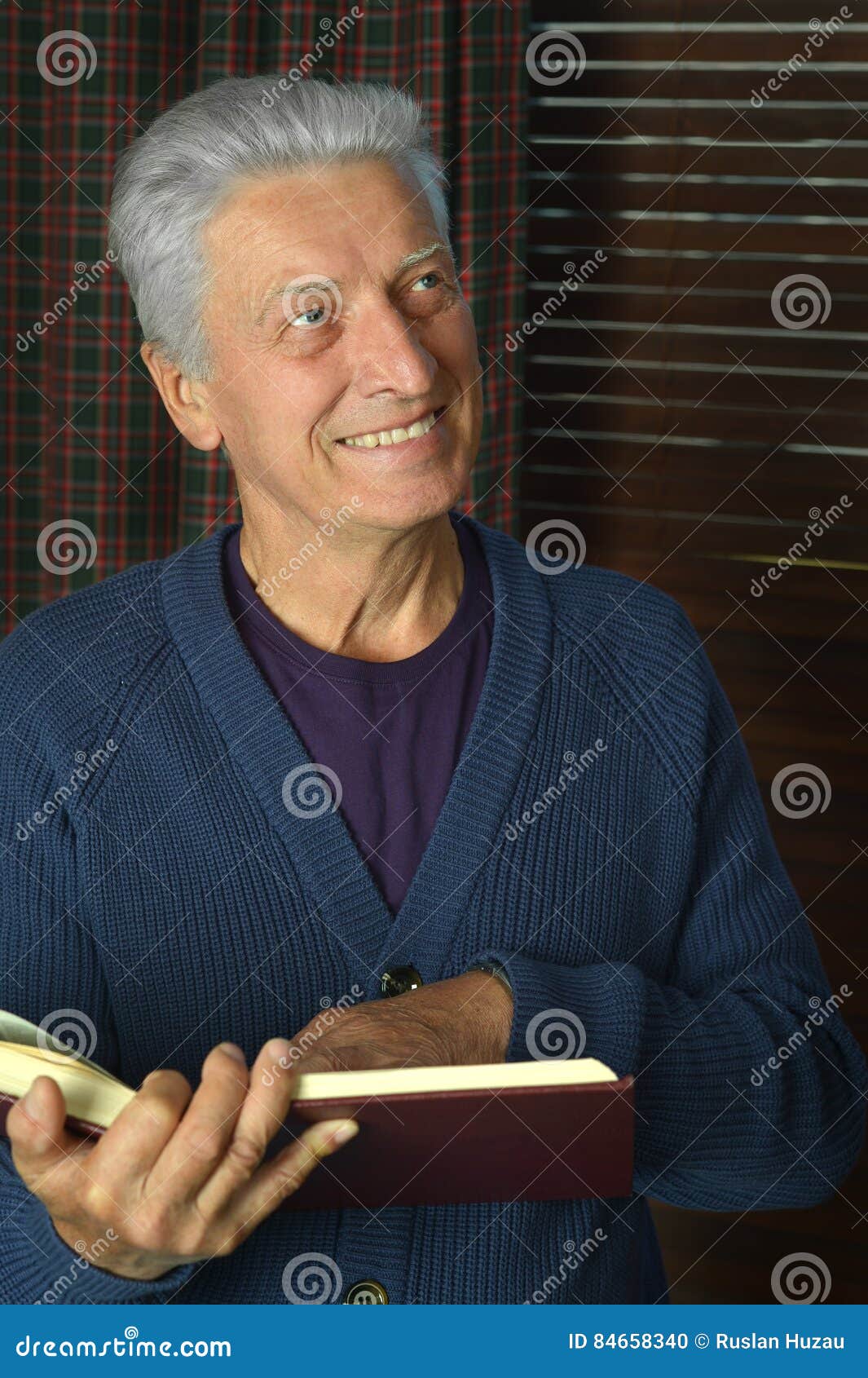 Happy man with book stock photo. Image of people, portrait - 84658340
