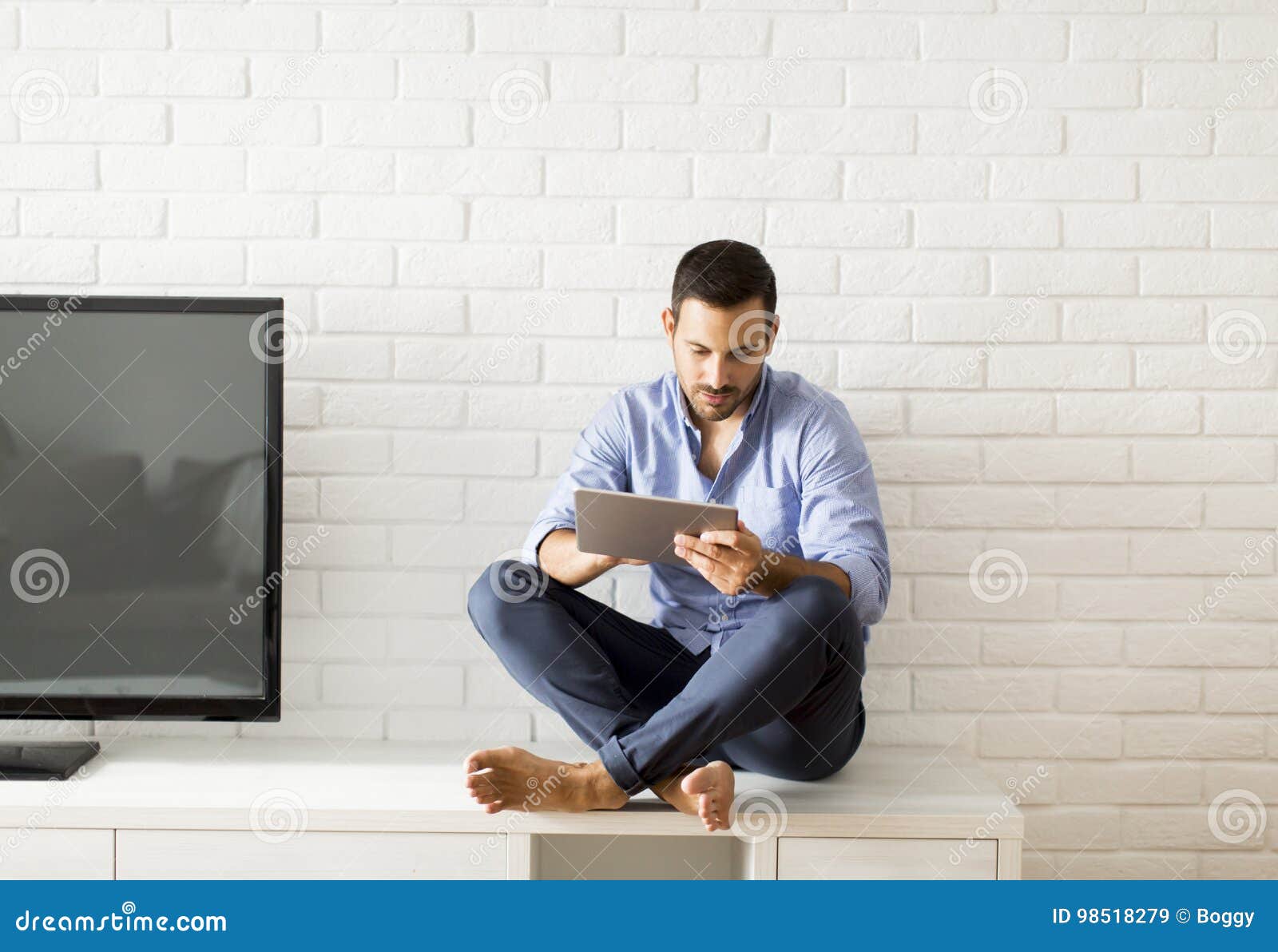 Happy Man Browsing with Tablet Sitting on Commode at Home Stock Image ...
