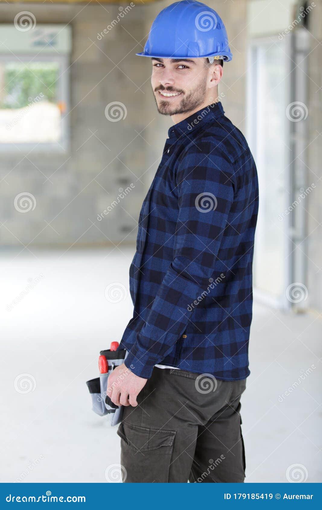 Happy man builder indoors stock image. Image of instrument - 179185419