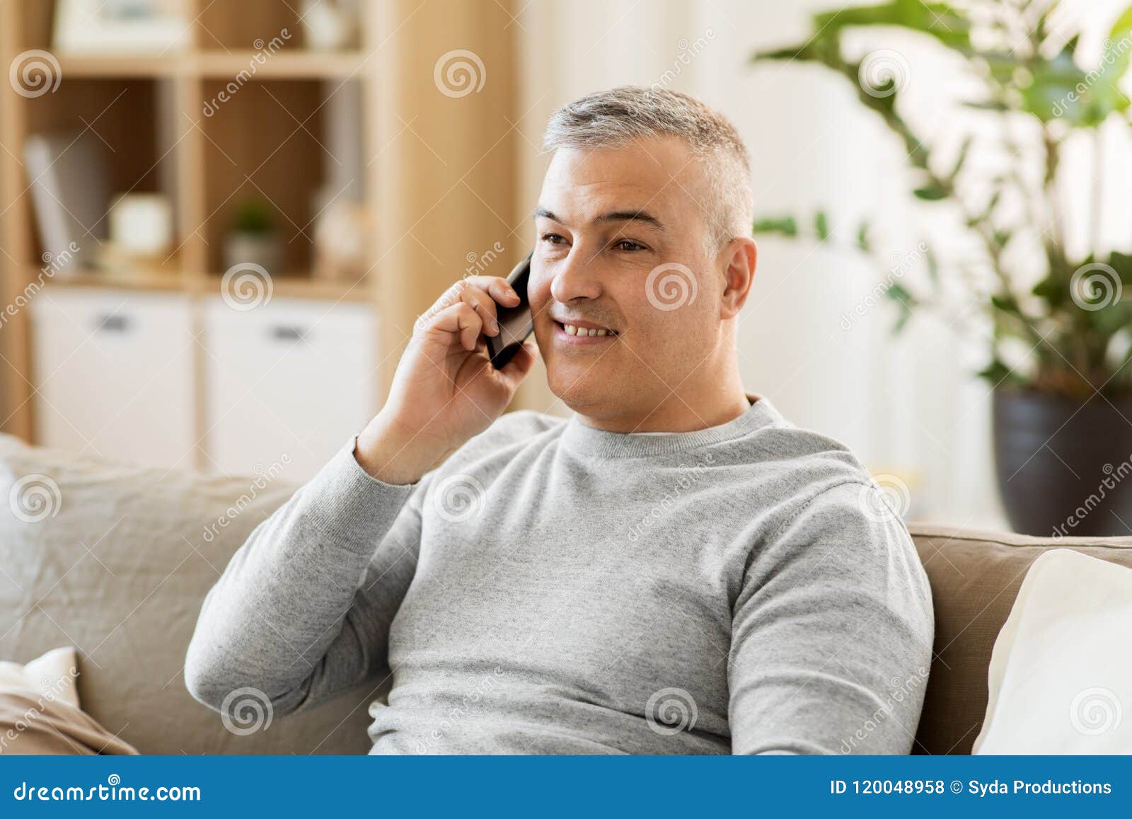 Happy Man Calling on Smartphone at Home Stock Photo - Image of male ...