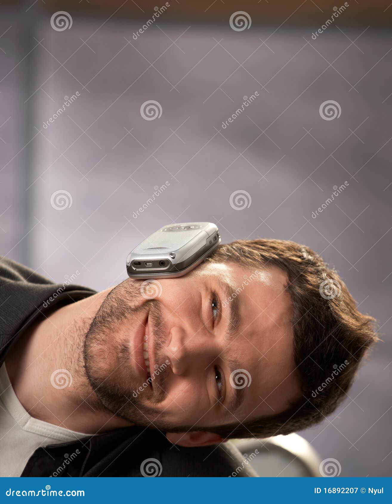 Happy man with cellphone stock image. Image of color - 16892207