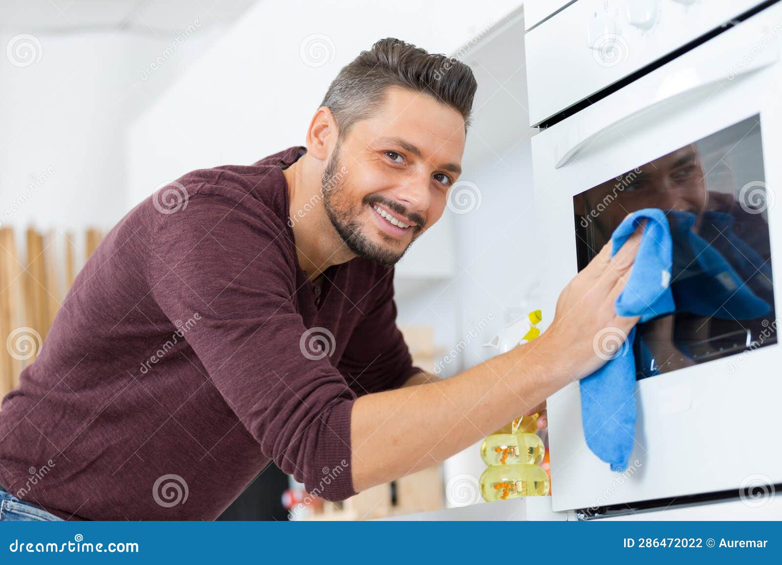 Happy Man Cleaning Oven in Kitchen Stock Photo - Image of worker ...