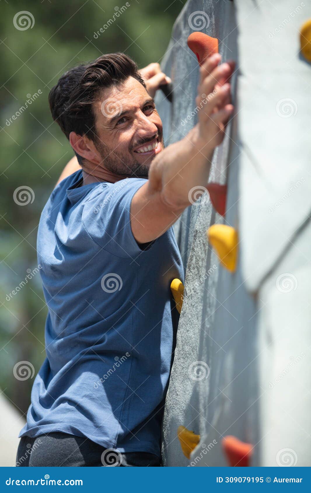 Happy Man Climber on Artificial Climbing Wall Stock Image - Image of ...