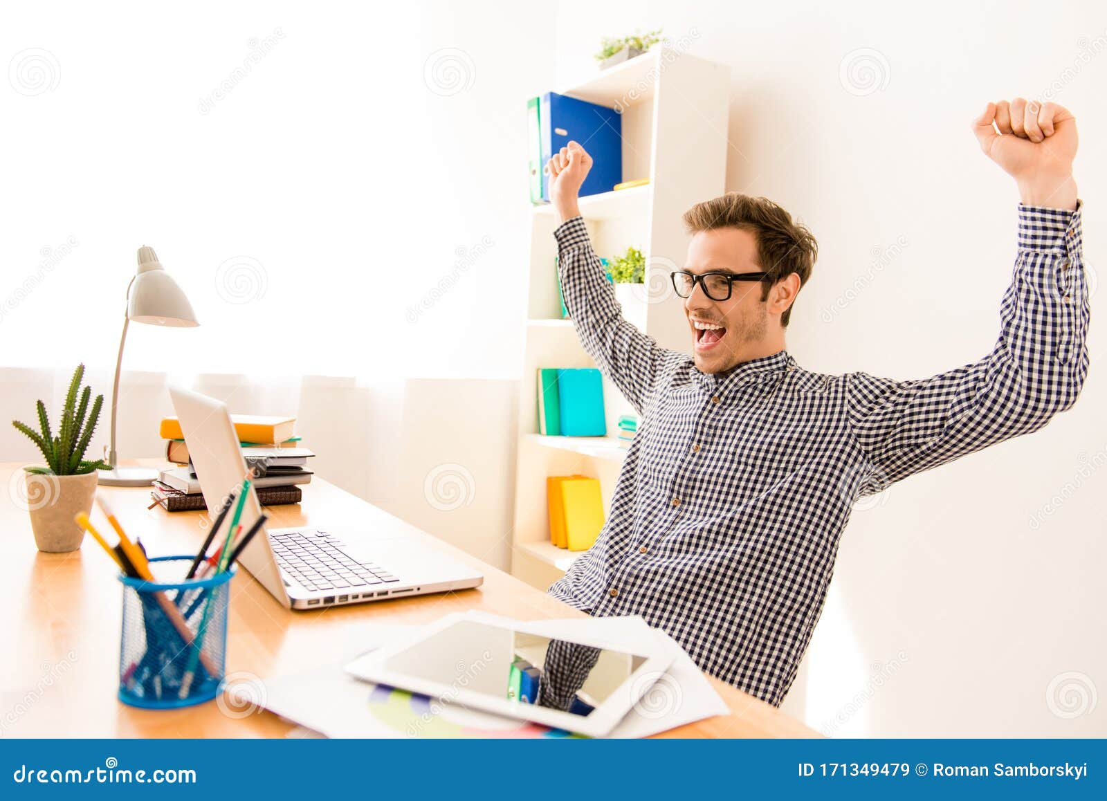 Happy Man Completed Task And Triumphing With Raised Hands Stock Image