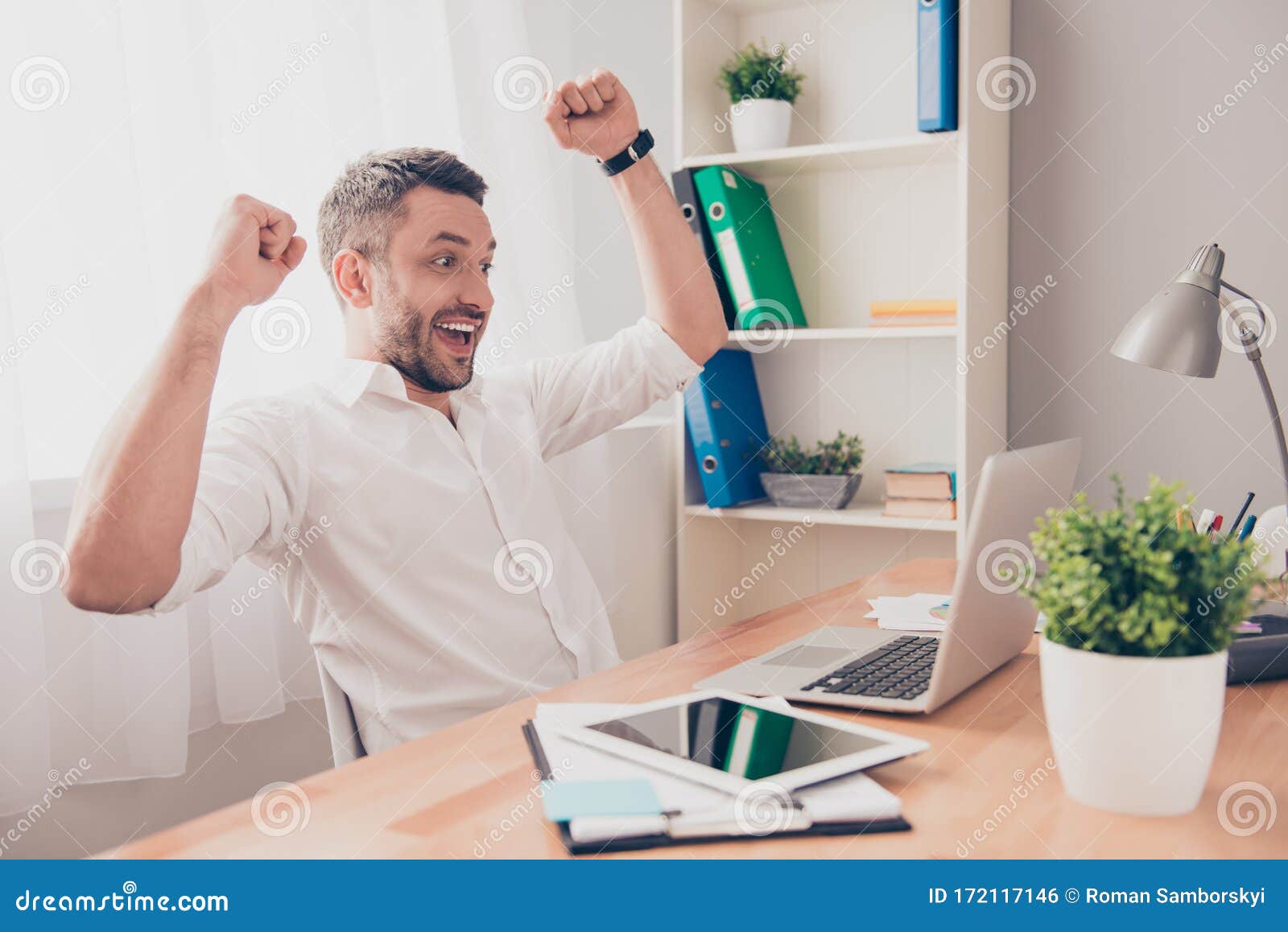 Happy Man Completed Task and Triumphing with Raised Hands Stock Photo ...