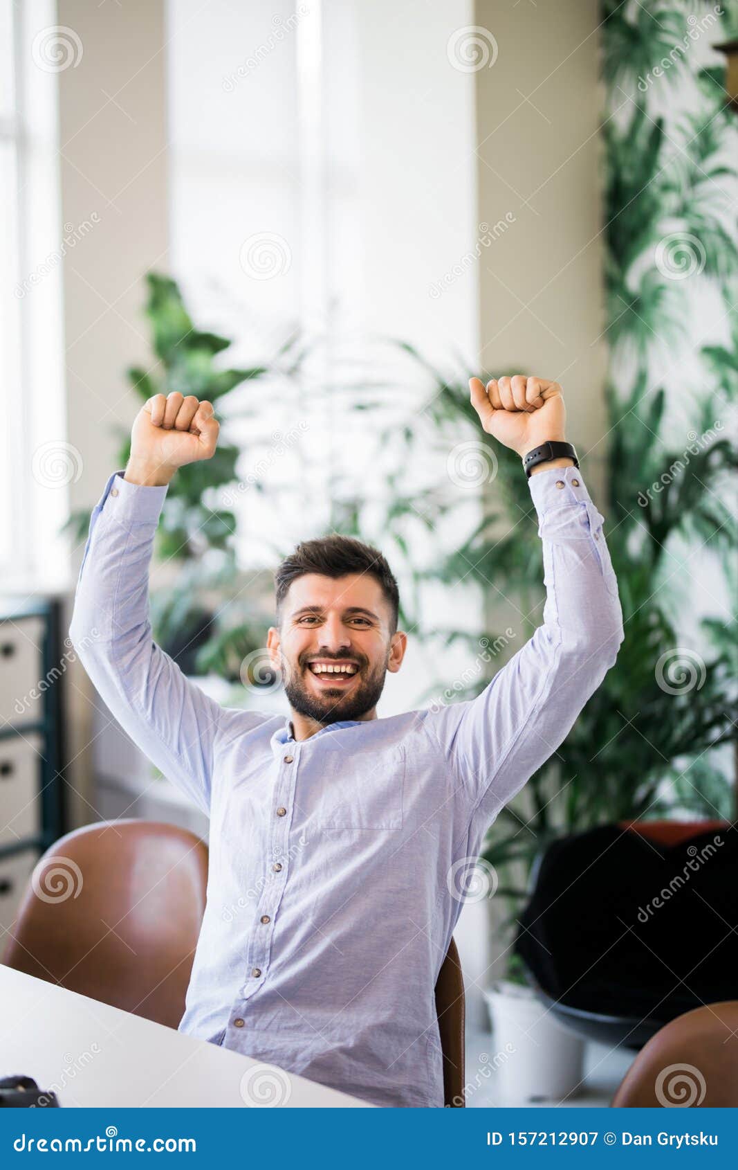 Happy Young Man Completed Task and Triumphing with Raised Hands Stock ...