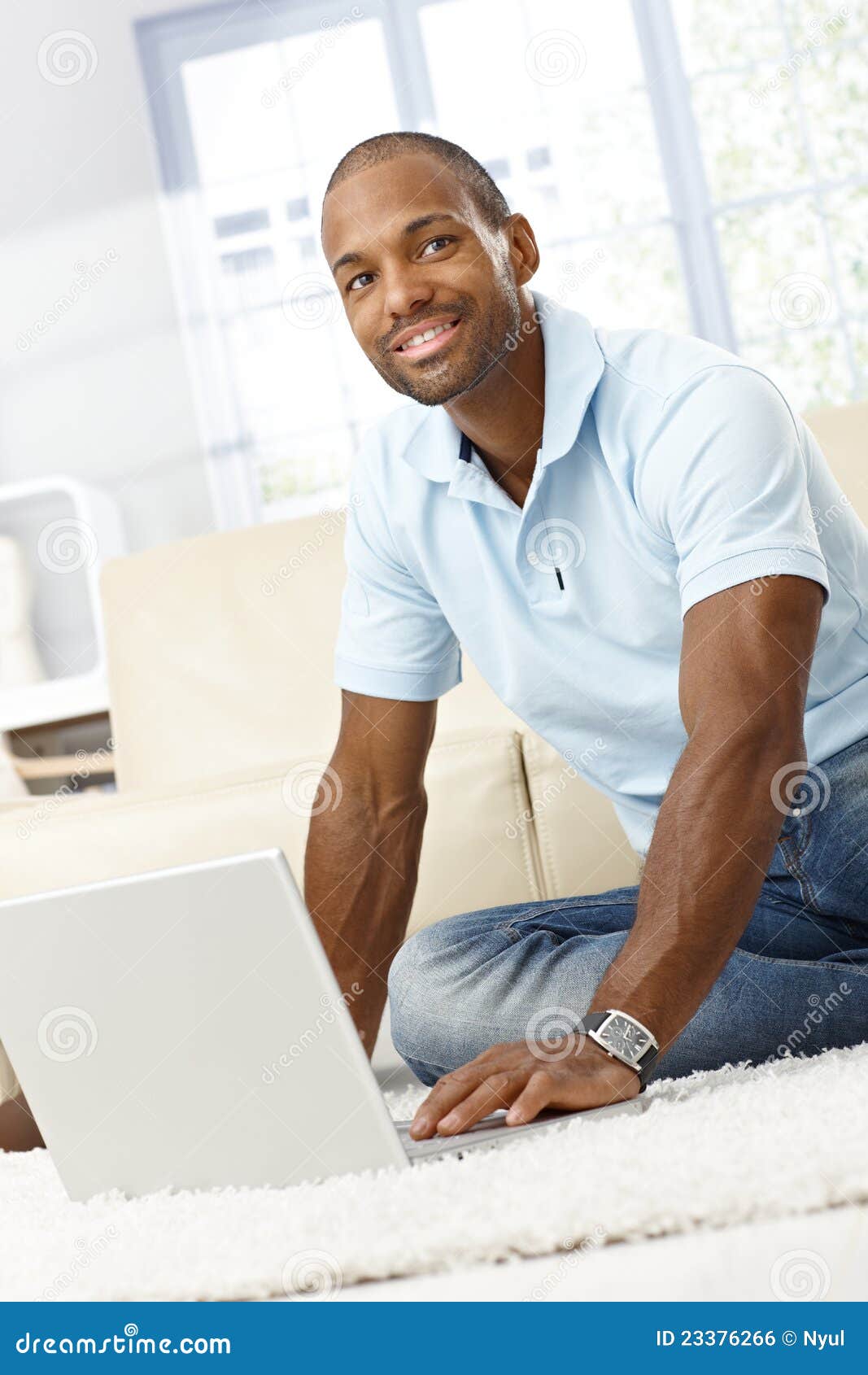 Happy man with computer stock photo. Image of cheerful - 23376266