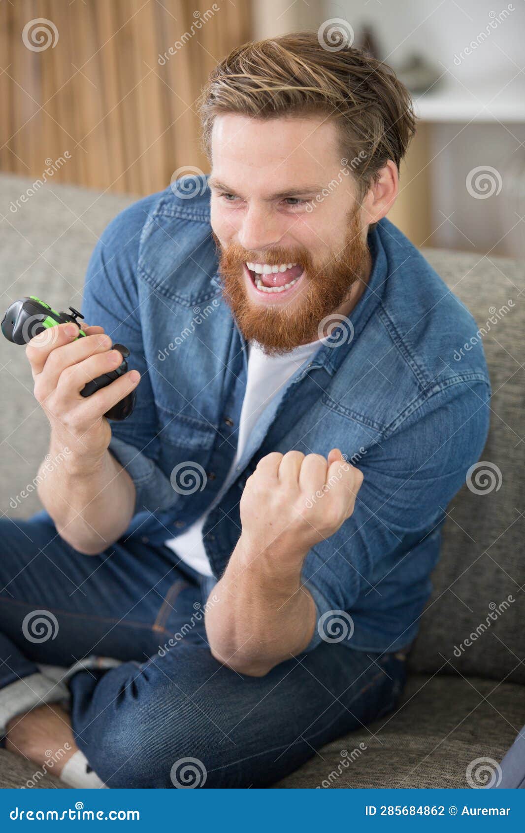 Happy Man Concentrated Playing Video Games with Video Game Controller ...