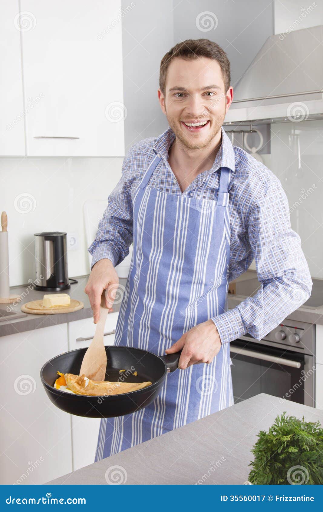 Happy Man Cooking Egg Omelet In The Kitchen Stock Image - Image of help ...