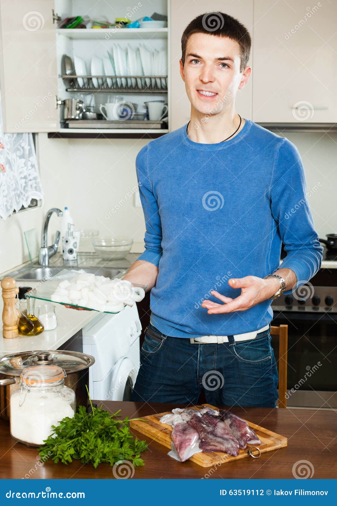 Happy Man Cooking Raw Squid Stock Photo - Image of full, happy: 63519112