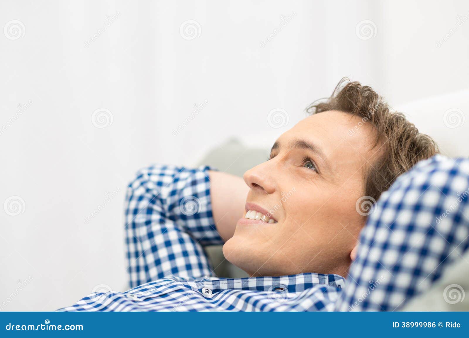 Happy Man Daydreaming on Sofa Stock Photo - Image of person ...