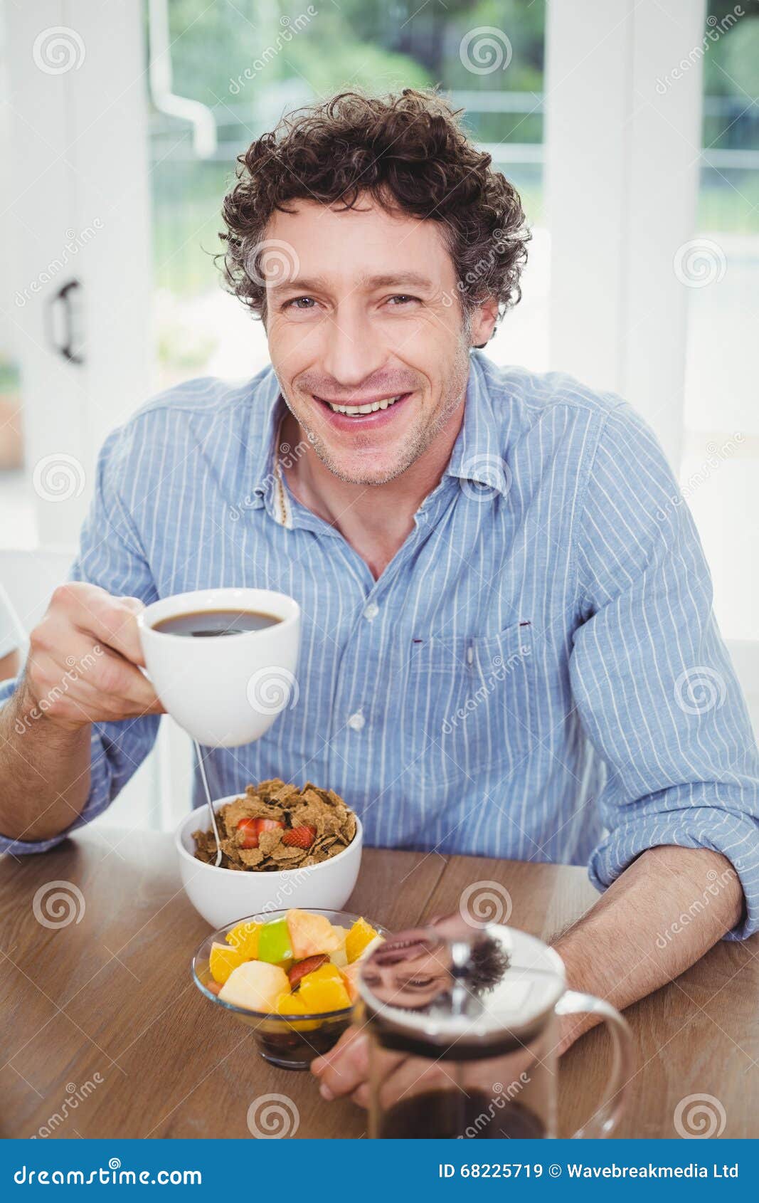 Happy Man Drinking Tea by Table Stock Image - Image of indoors ...