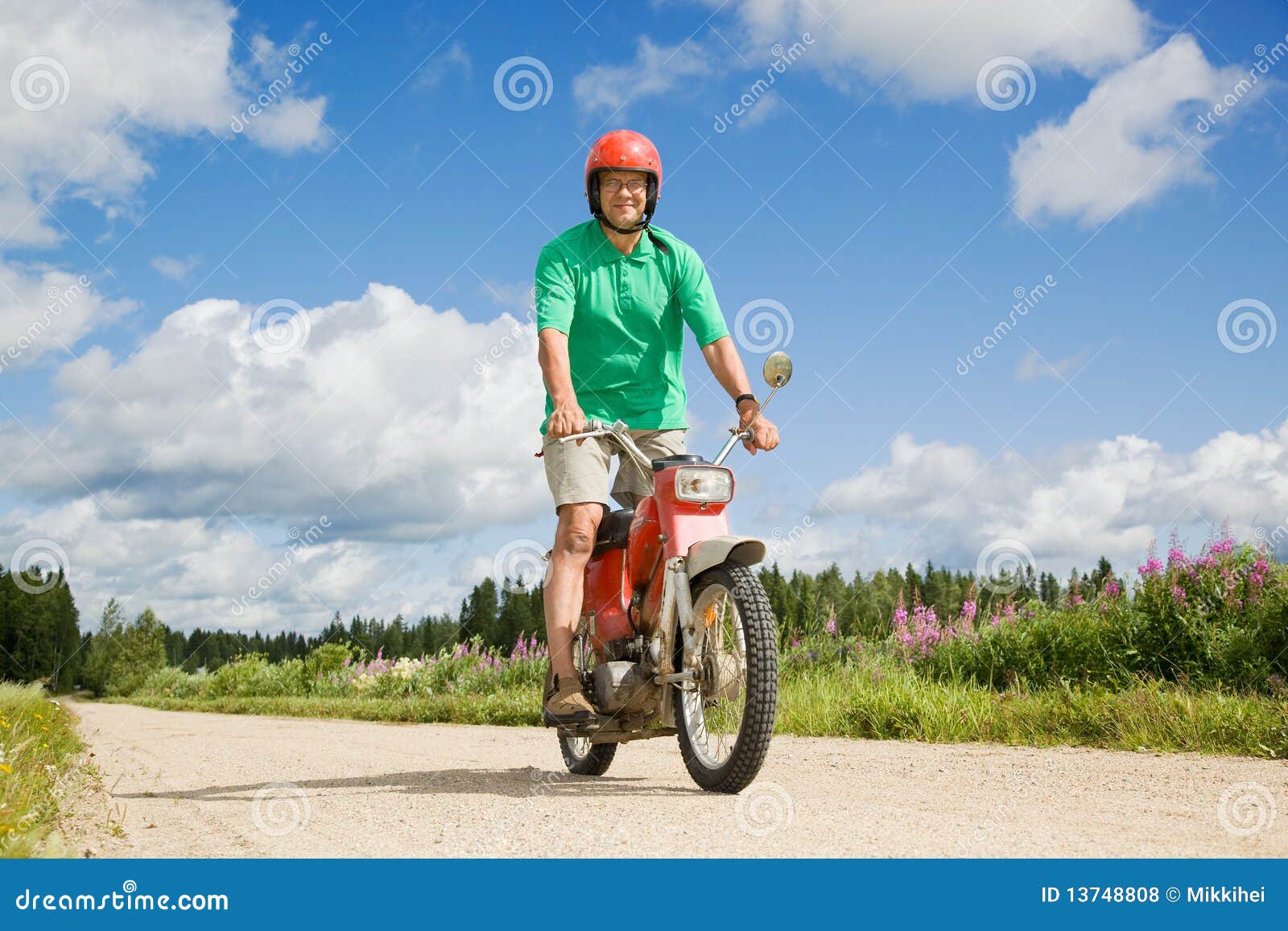 Happy man driving a moped stock photo. Image of motor - 13748808
