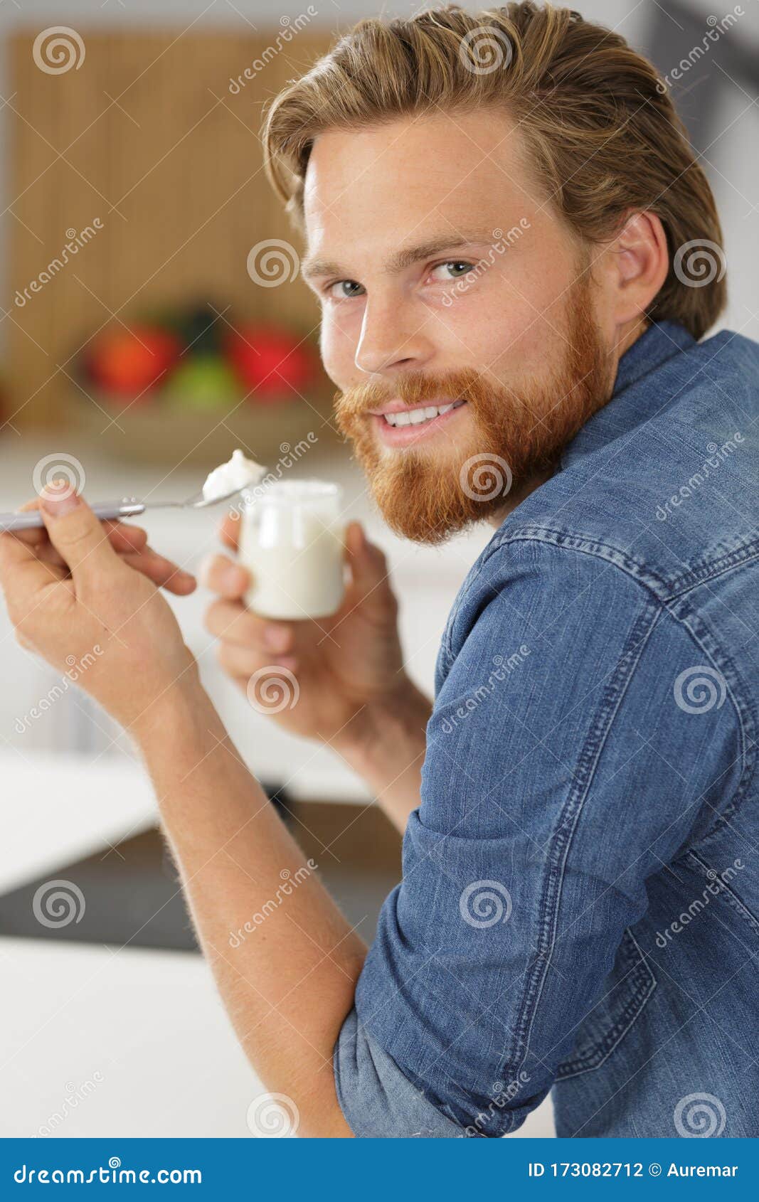 Happy Man Eating Yogurt at Home Stock Photo - Image of fitness, spoon ...