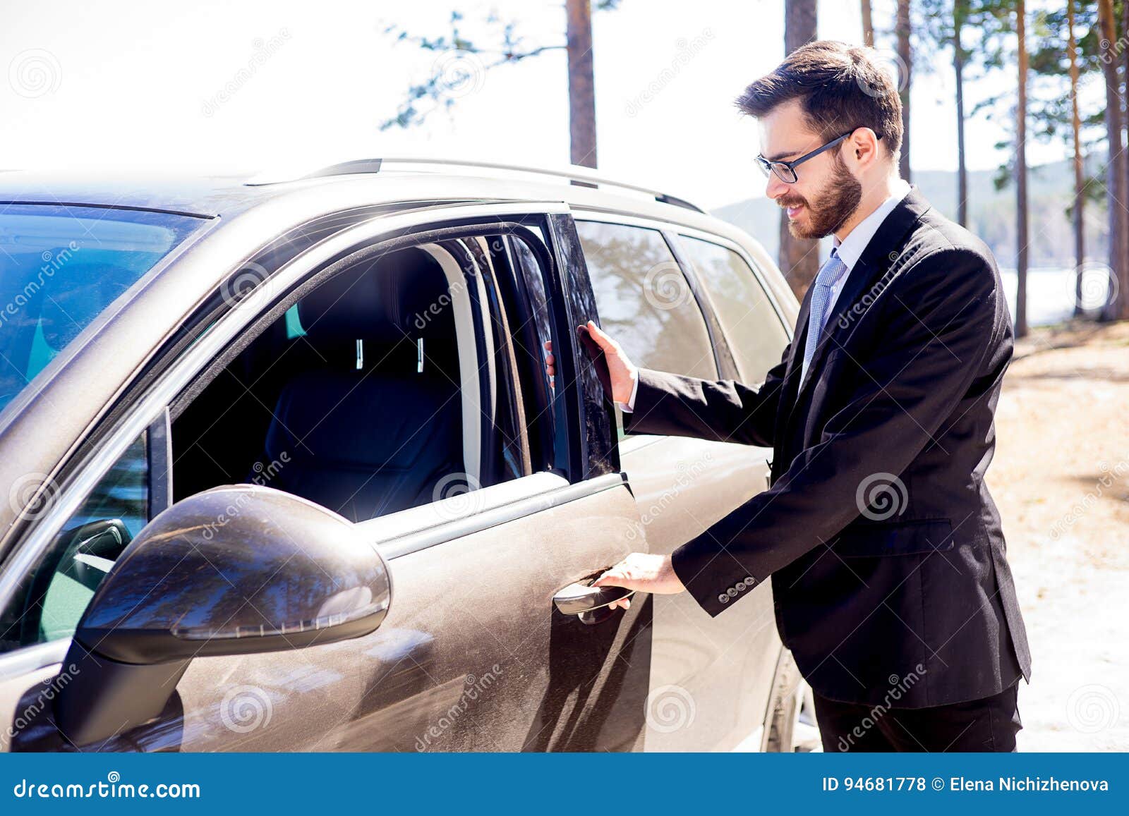 Happy man entering his car stock photo. Image of adult - 94681778