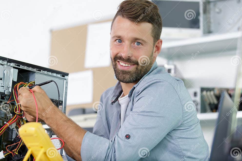 Happy man fixing computer stock photo. Image of computer - 277100864