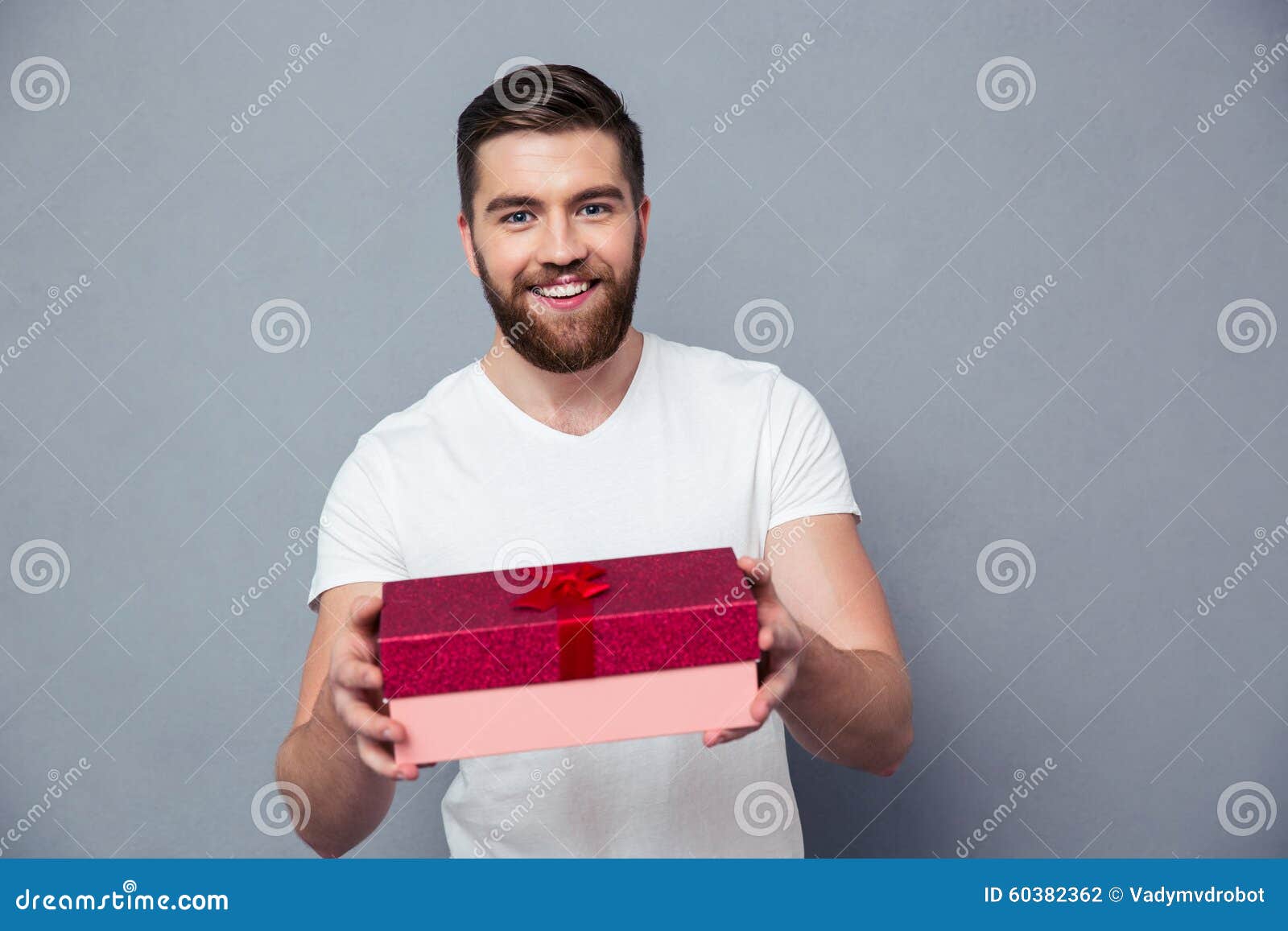 Happy Man Giving Gift Box on Camera Stock Photo - Image of holding ...