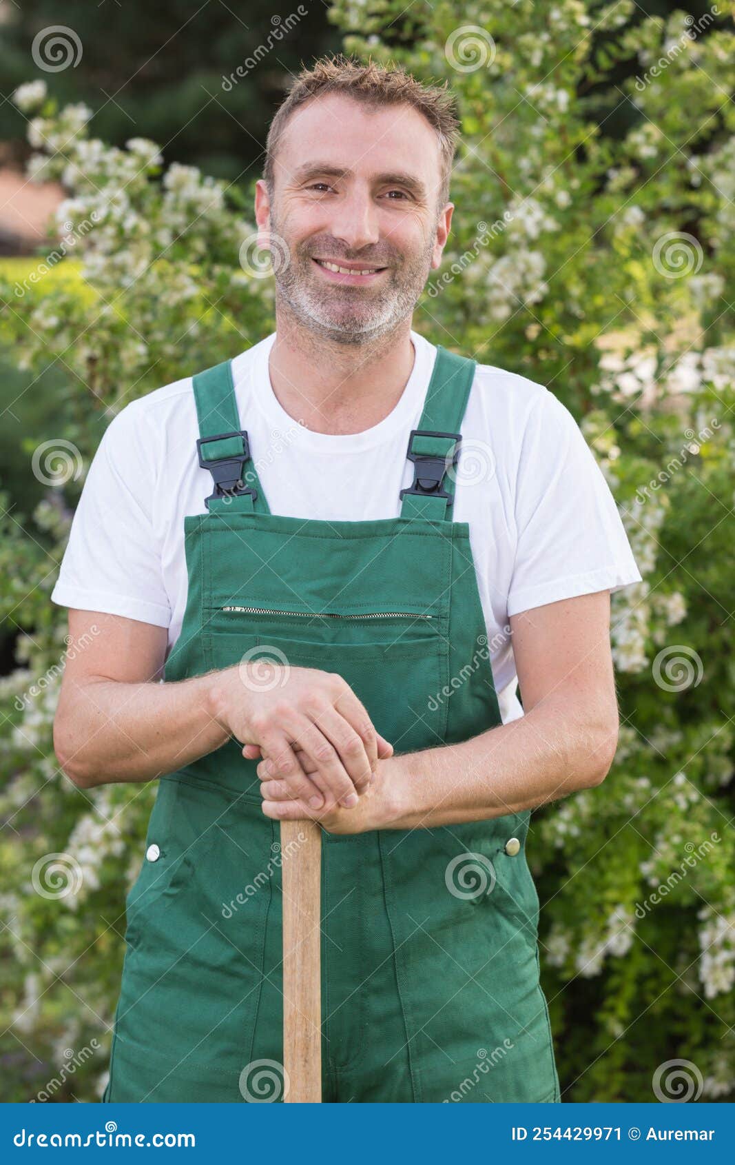 Happy man holding rake stock image. Image of lawn, manualworker - 254429971
