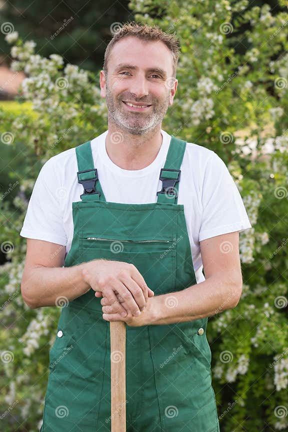 Happy man holding rake stock image. Image of lawn, manualworker - 254429971