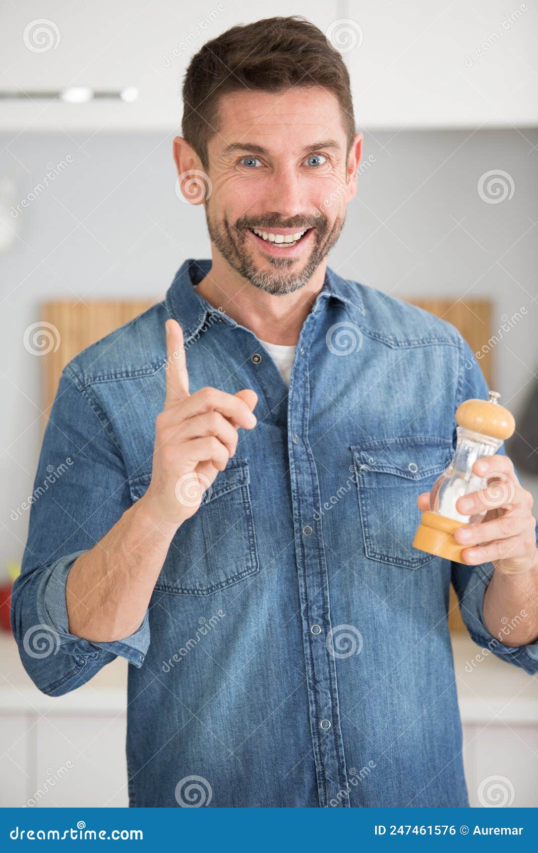 Happy man holding salt stock photo. Image of leisure - 247461576