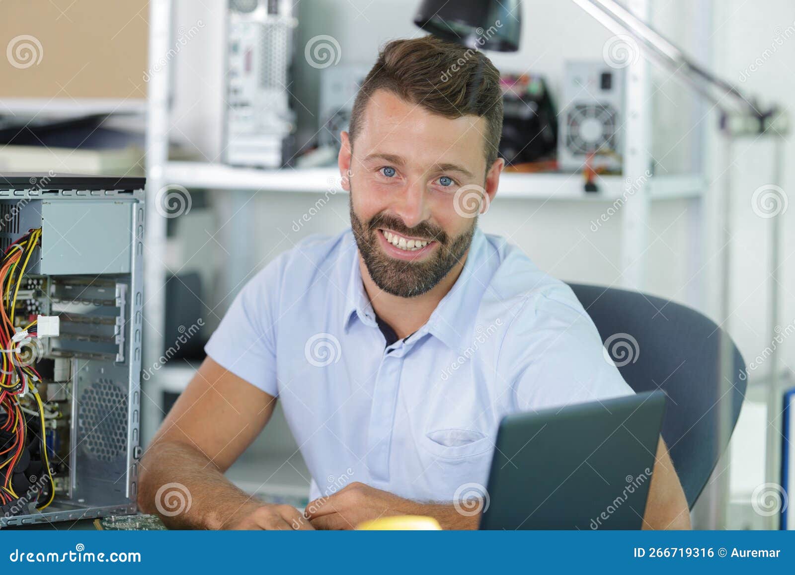 Happy man holding tablet stock photo. Image of success - 266719316