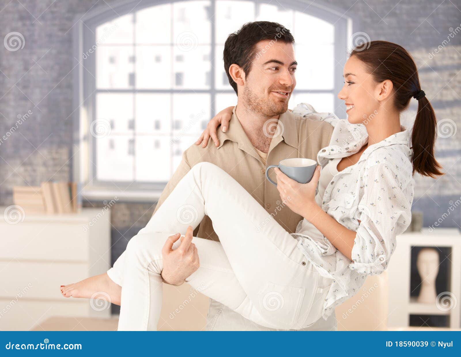 Happy Man Holding Woman In His Arms Smiling Stock Image Image 18590039
