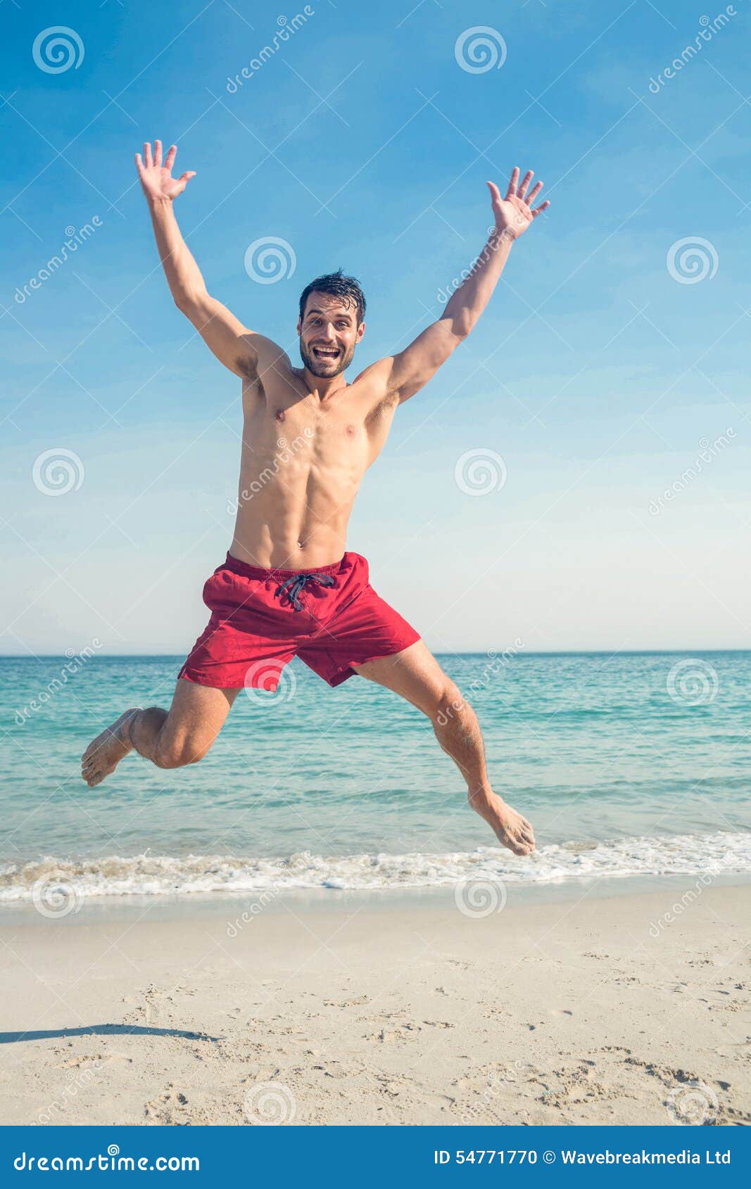 Happy Man Jumping on the Beach Stock Photo - Image of vacation, freedom ...