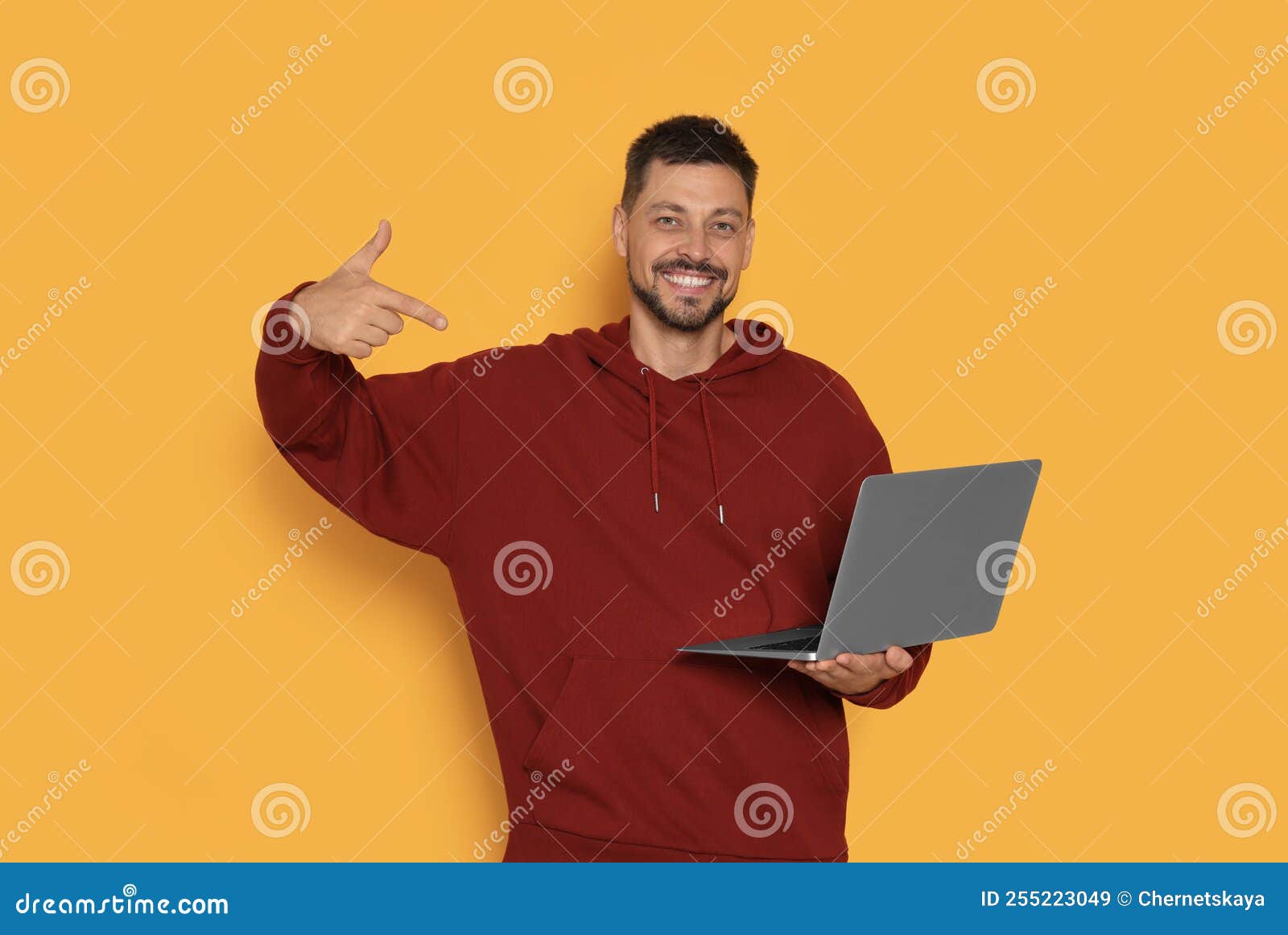 Happy Man with Laptop on Orange Background Stock Image - Image of ...