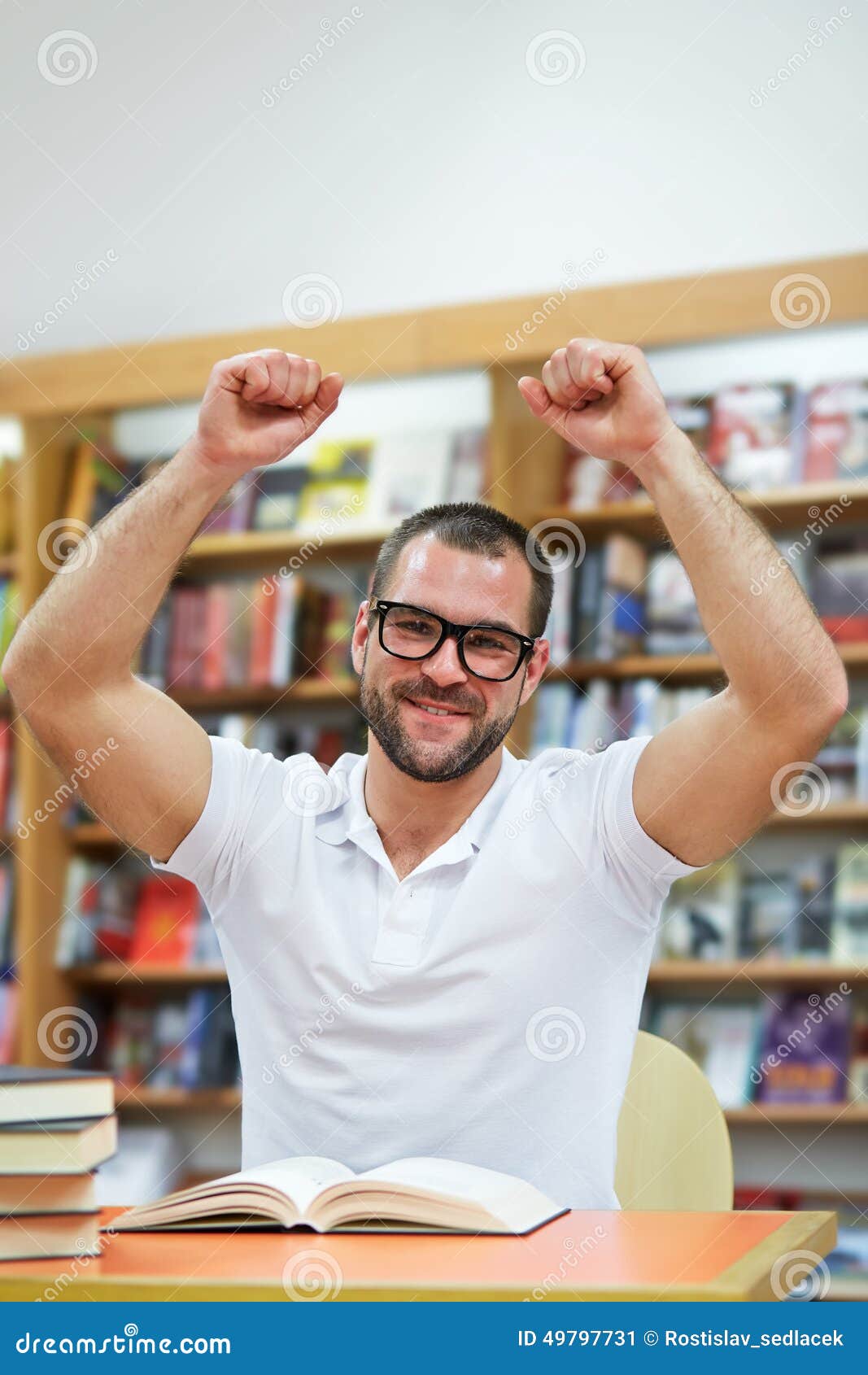 Happy man in the library stock image. Image of looking - 49797731