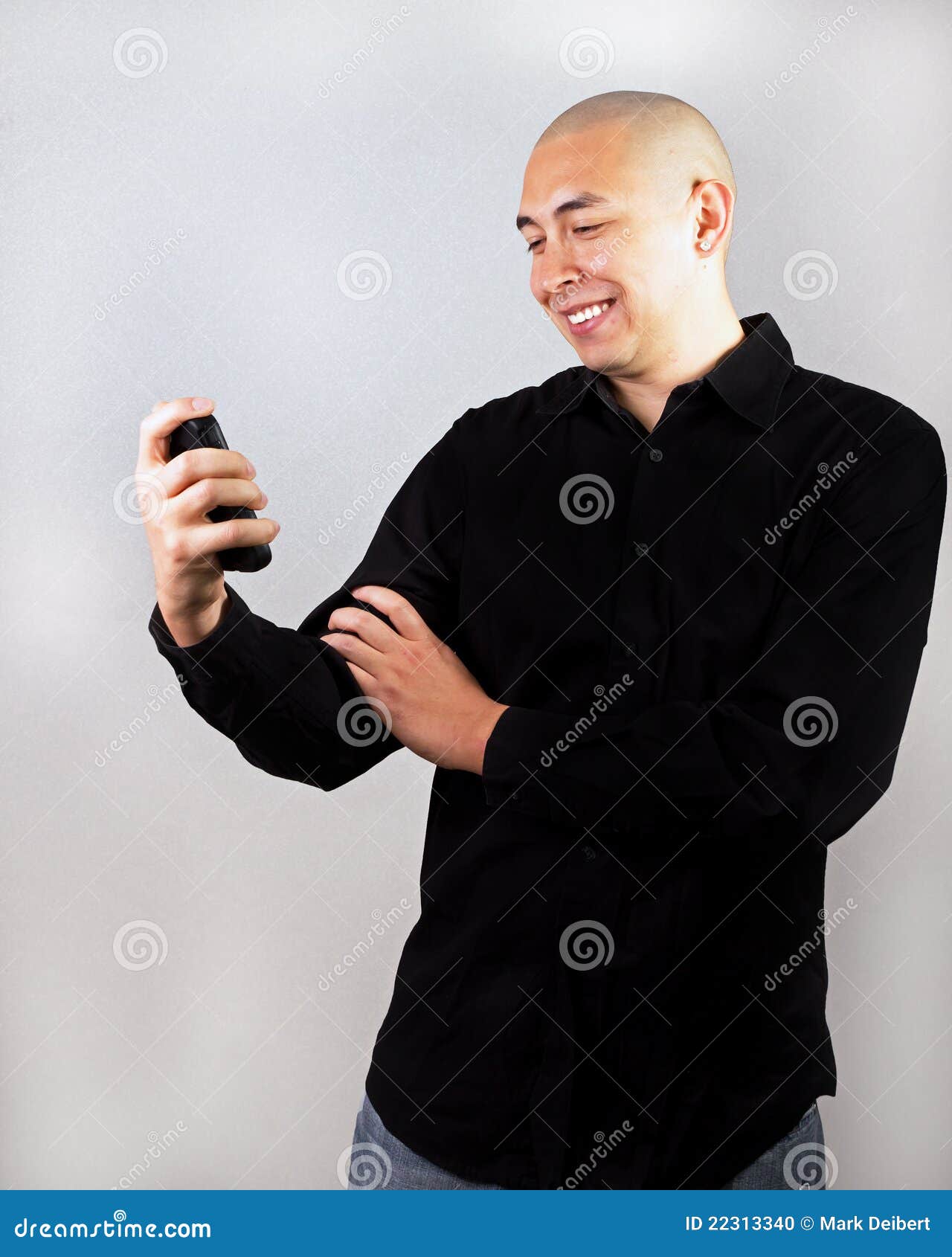 Happy Man Looking at His Smartphone Stock Photo - Image of technology ...