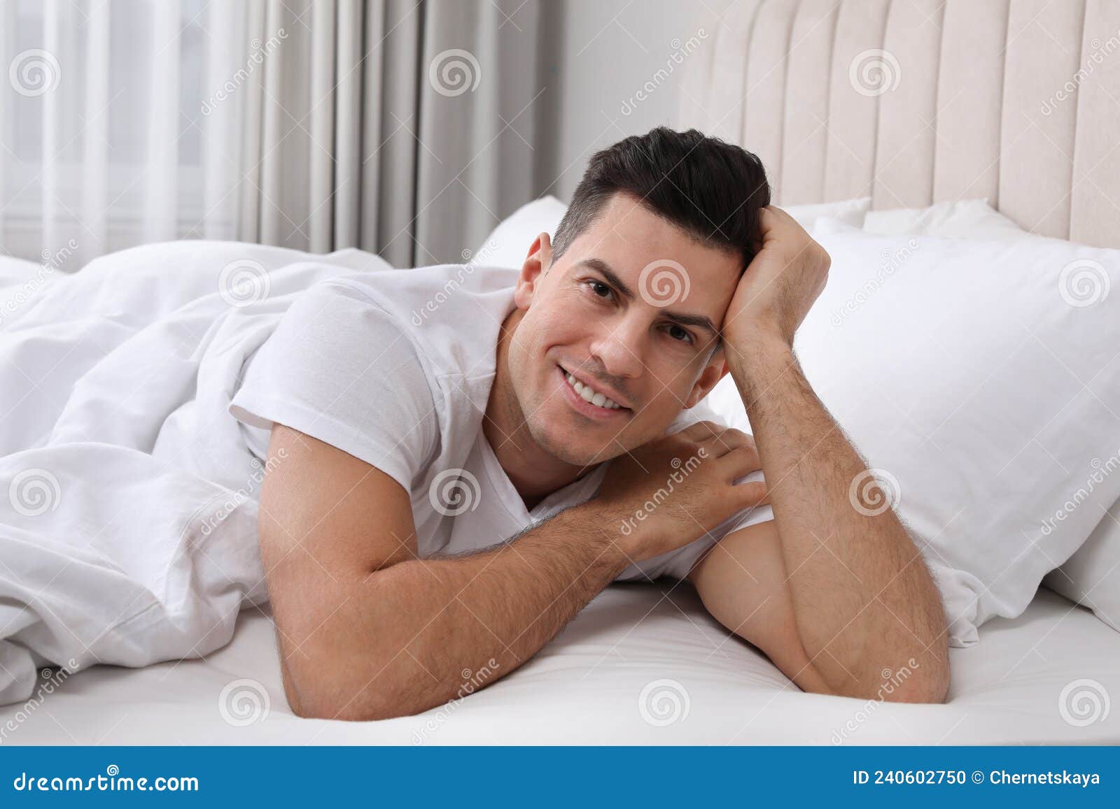 Happy Man Lying in Bed at Home Stock Photo - Image of person, handsome ...