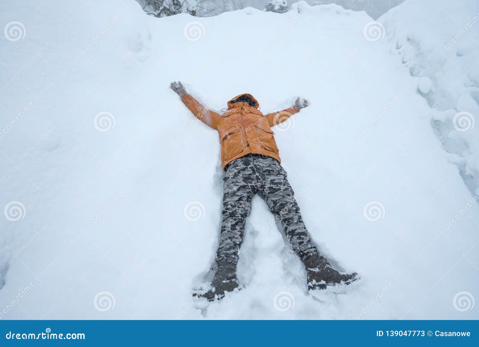 Happy Man Lying Down on the Snow in Winter Stock Image - Image of snowy ...