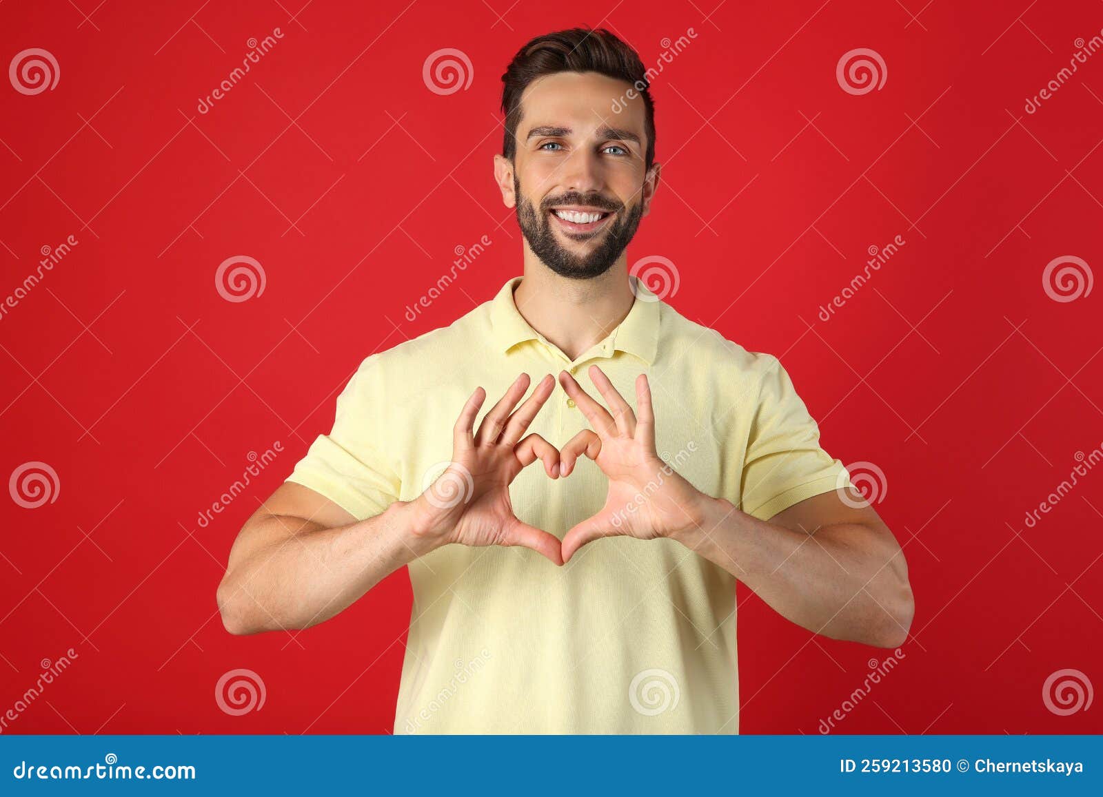 Happy Man Making Heart with Hands on Red Background Stock Photo - Image ...