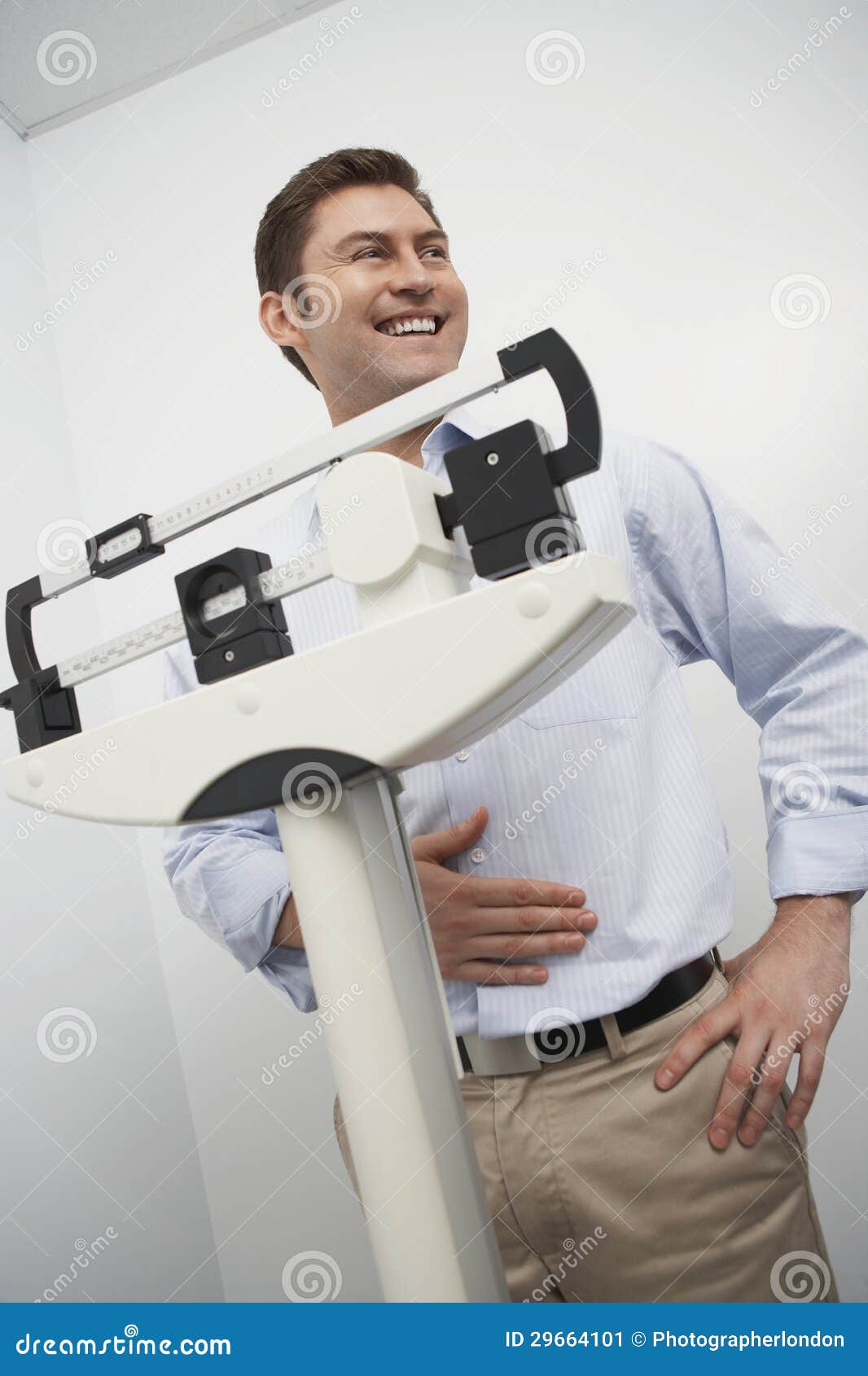 Happy Man Measuring Weight on Weighing Scale Stock Image - Image of ...