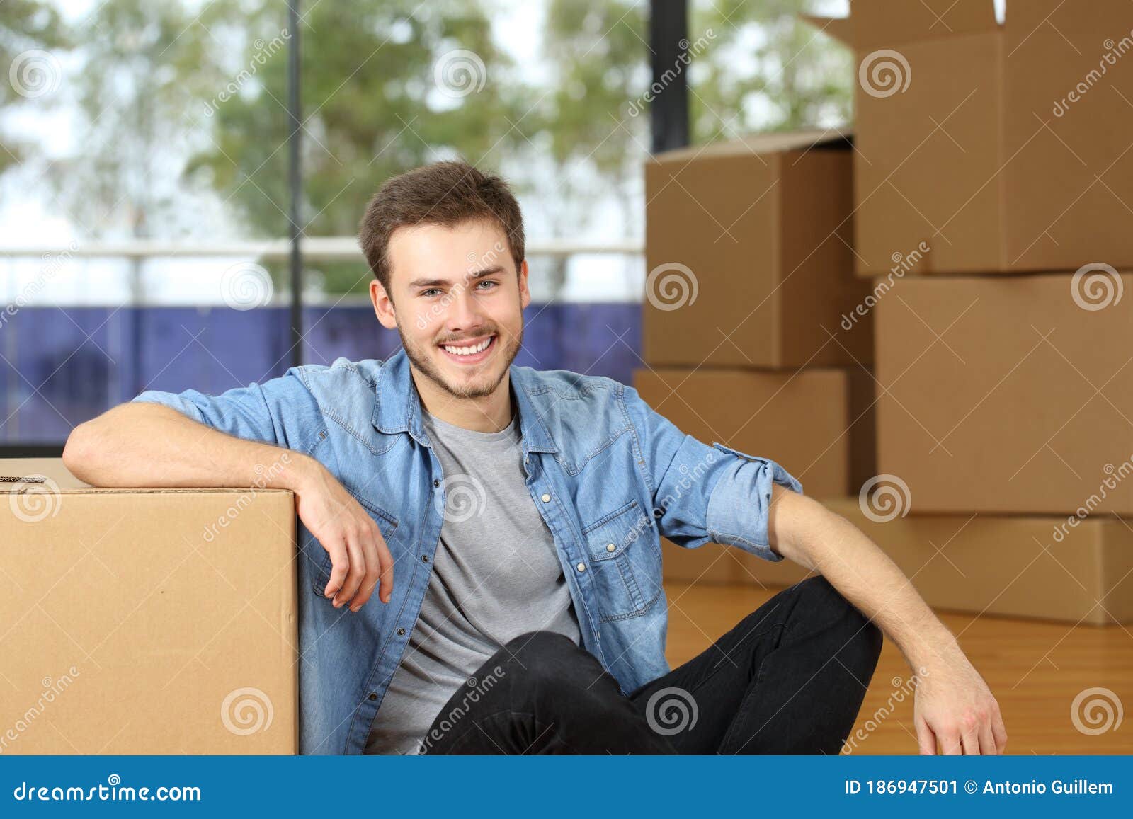 Happy Man Moving Home Looking at Camera Stock Image - Image of dream ...