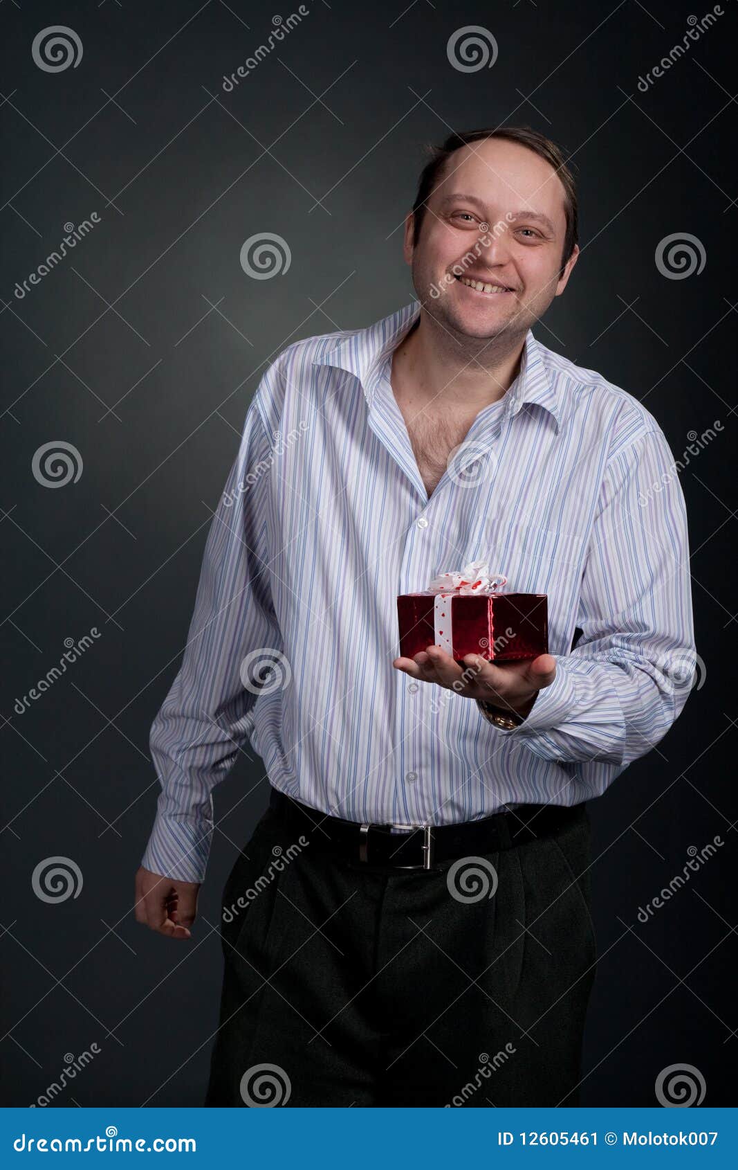 Happy man offering gifts stock image. Image of present - 12605461