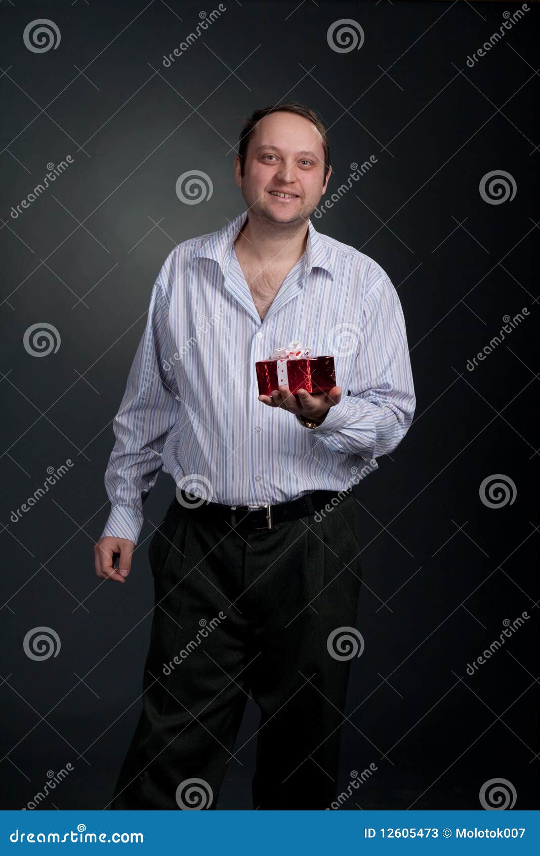 Happy man offering gifts stock image. Image of present - 12605473