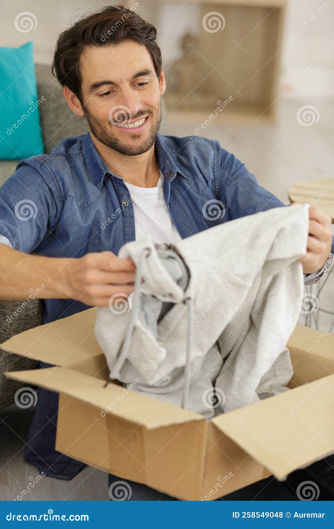 Happy Man Opening Parcel Box at Home Stock Photo - Image of livingroom ...