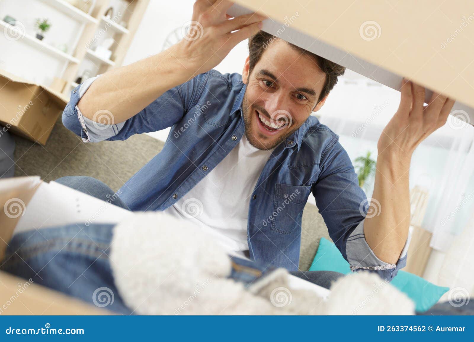 Happy Man Opening Parcel Box at Home Stock Photo - Image of human ...