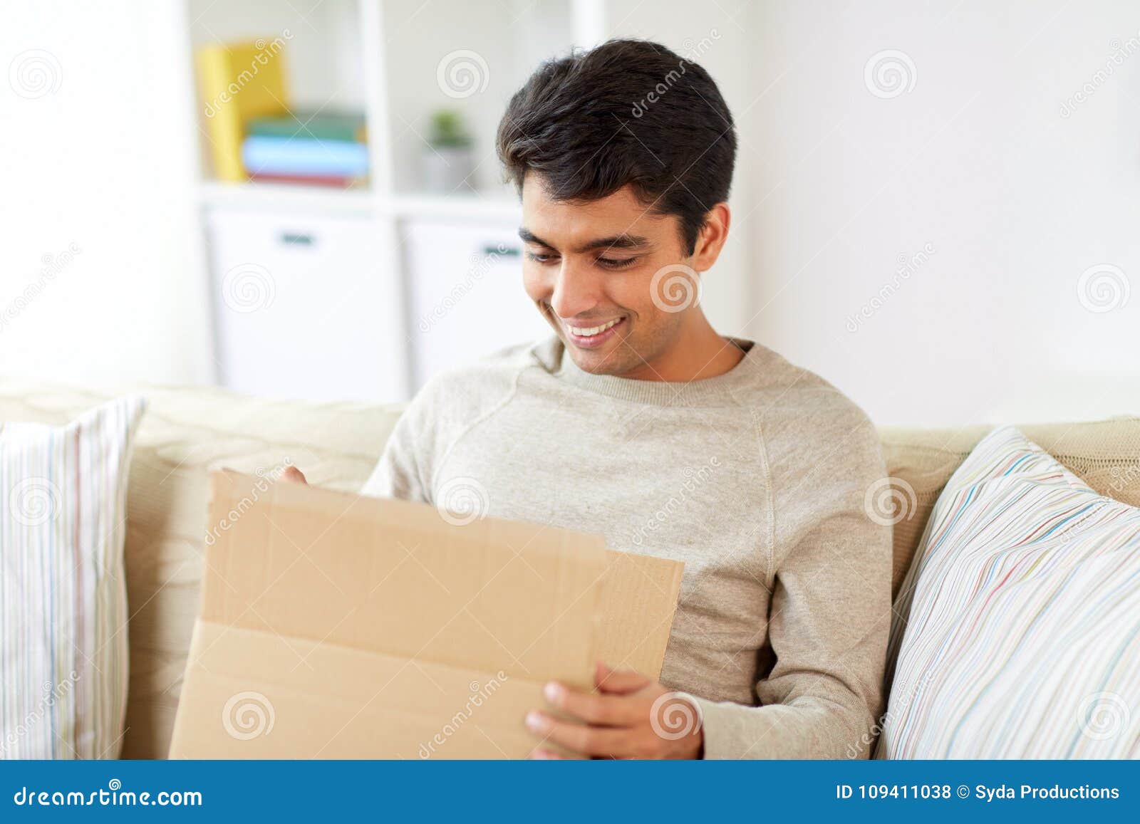 Happy Man Opening Parcel Box at Home Stock Photo - Image of opening ...