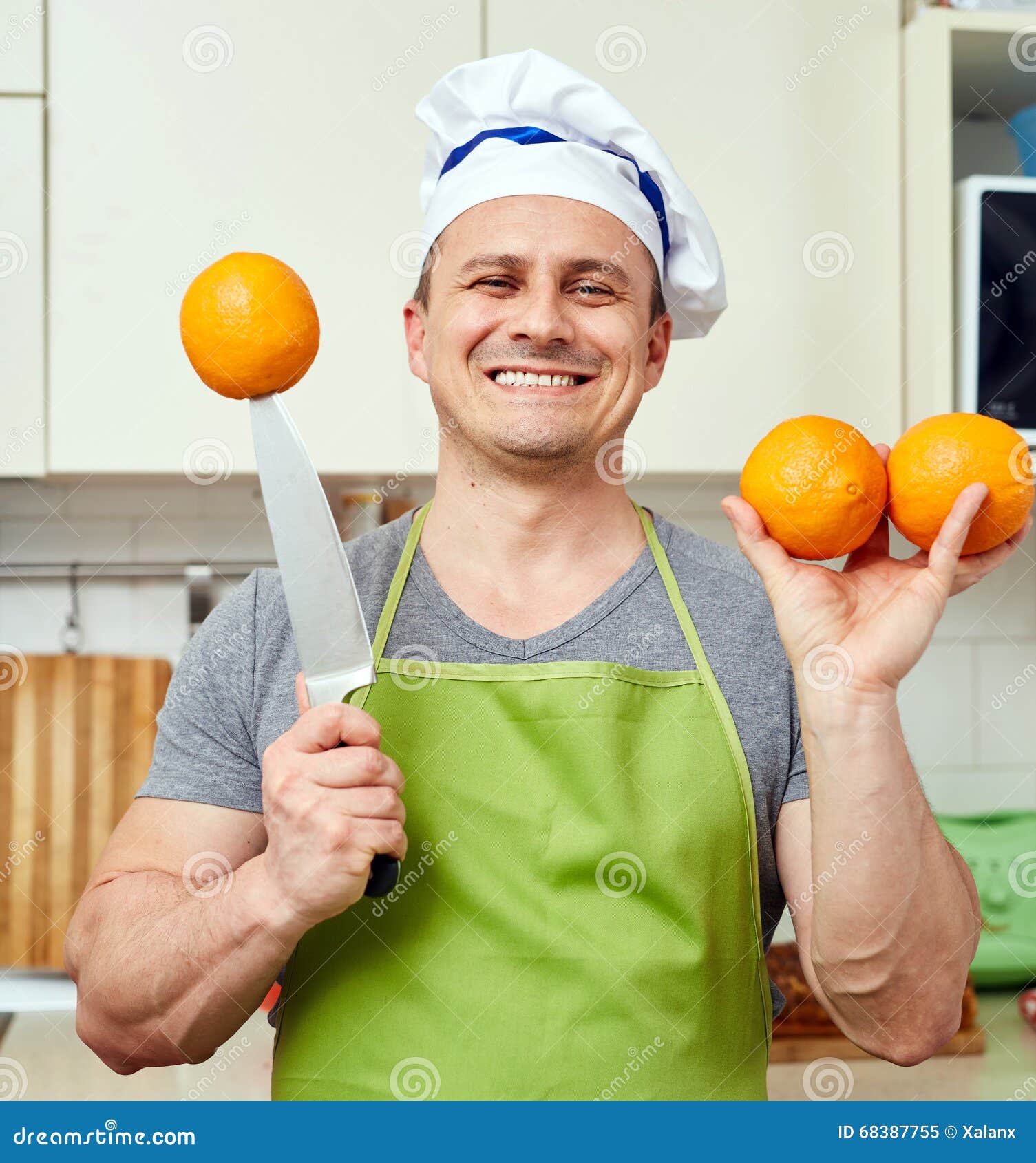 Happy man with oranges stock image. Image of cheerful - 68387755