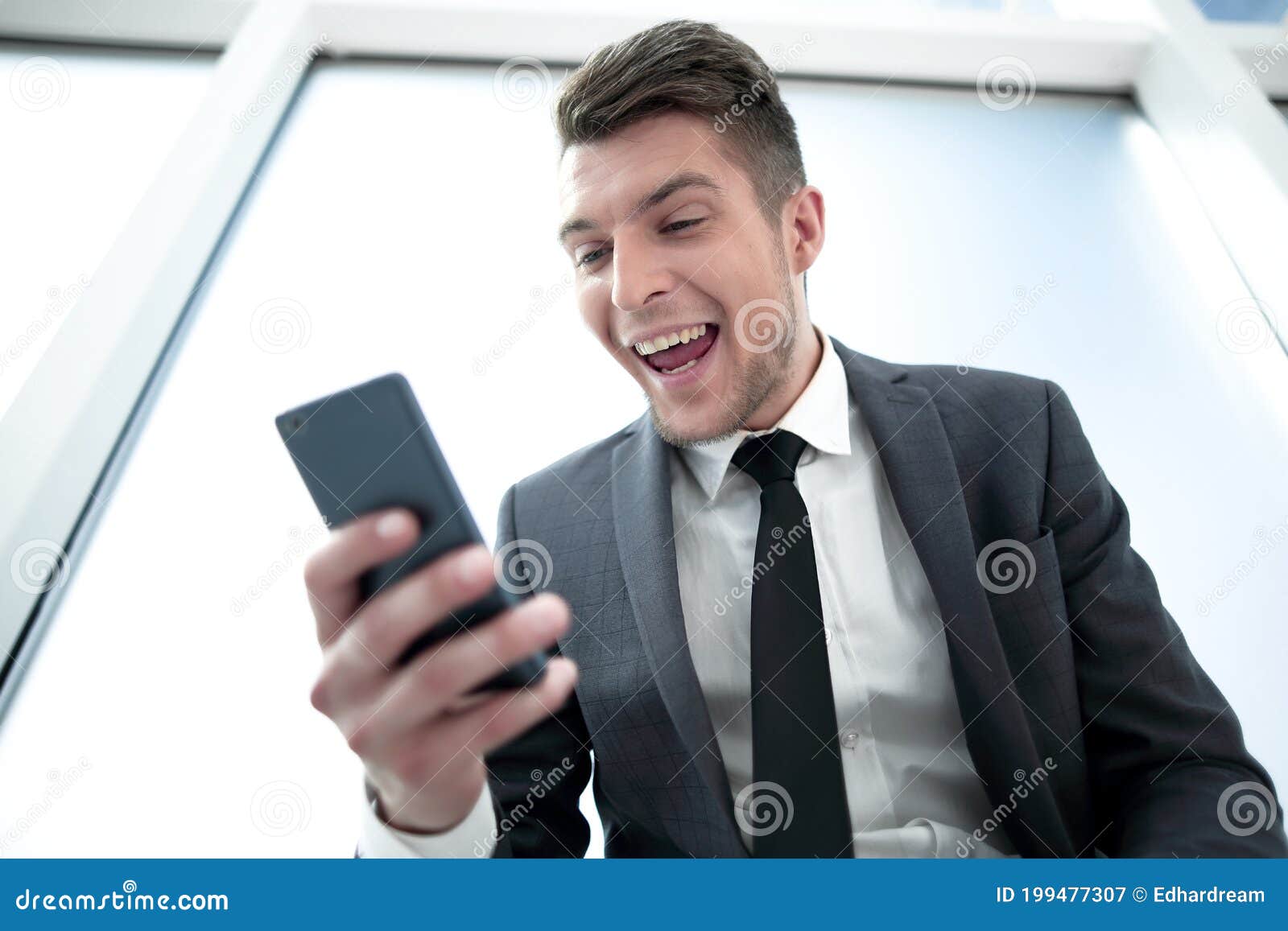 Happy man with phone stock image. Image of mobility - 199477307