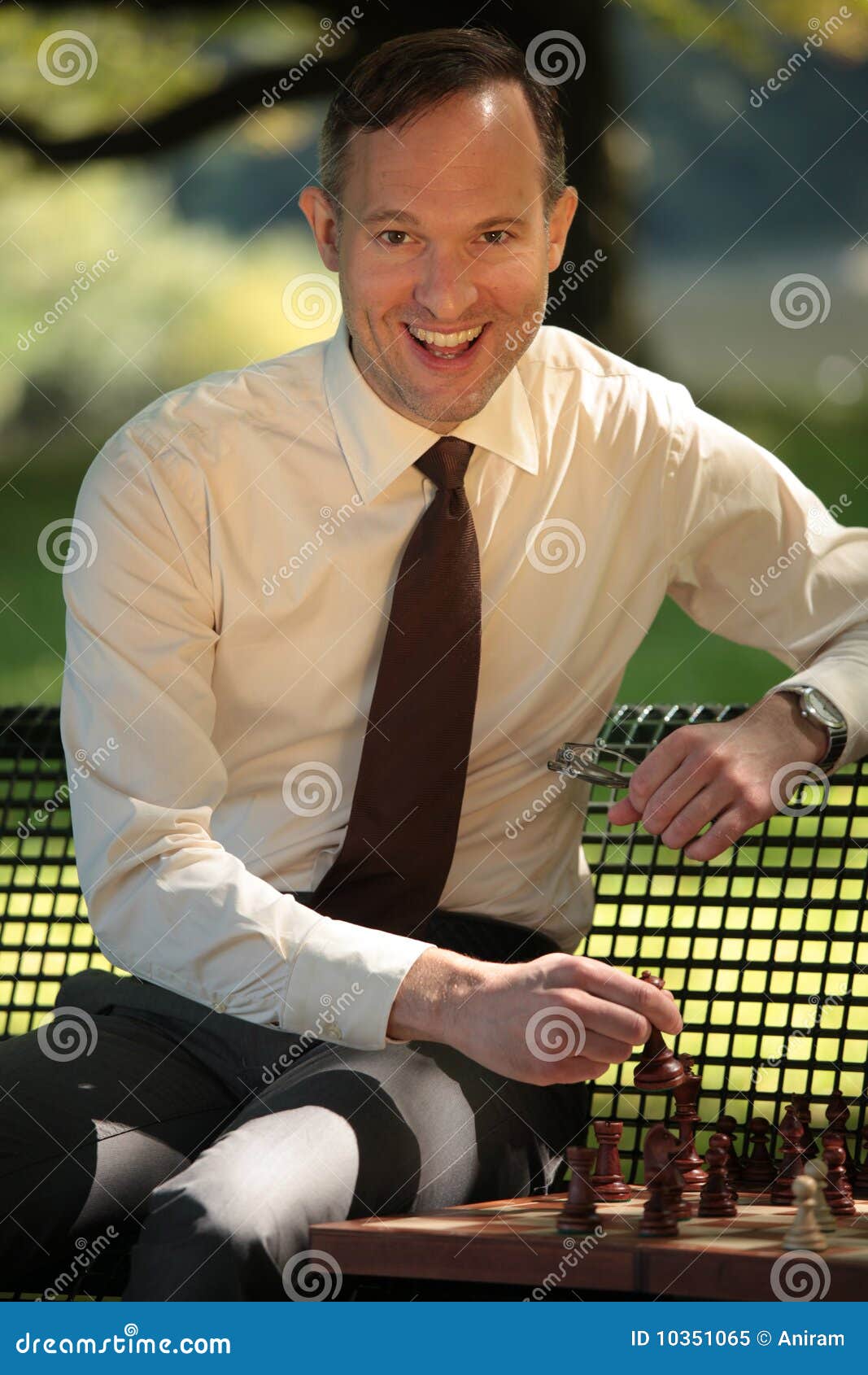 Happy man playing chess stock image. Image of success - 10351065