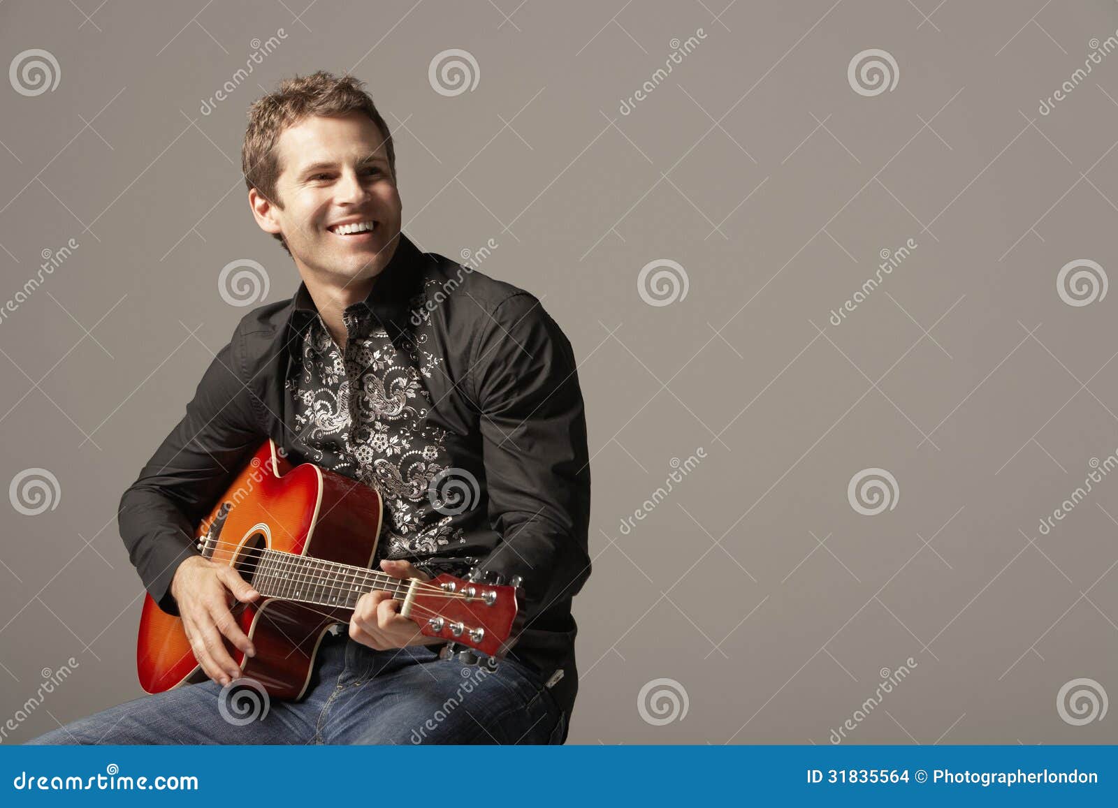 Happy Man Playing Guitar stock photo. Image of looking - 31835564