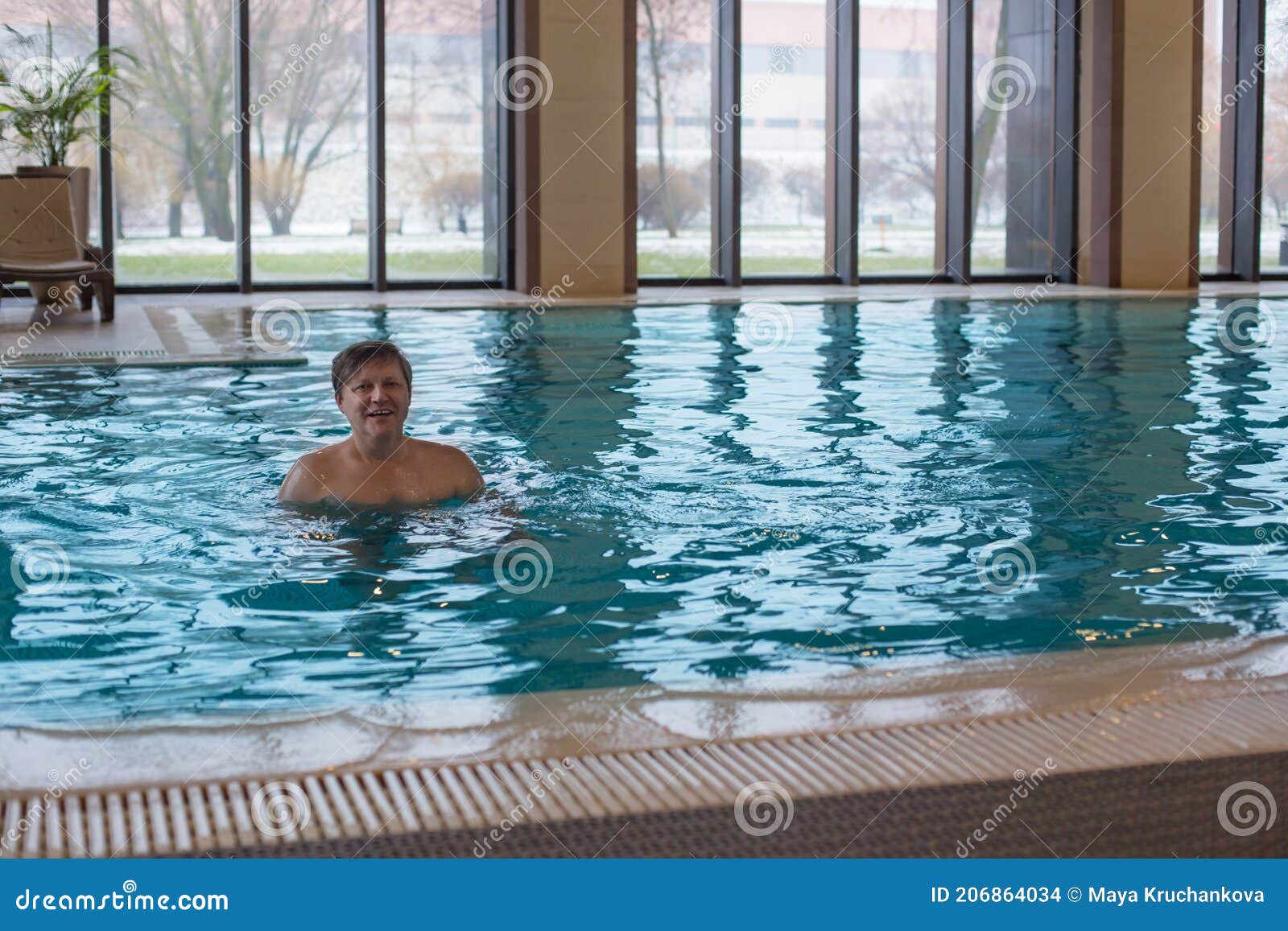 Happy Man in Pool with Panoramic Windows Stock Photo - Image of indoor ...