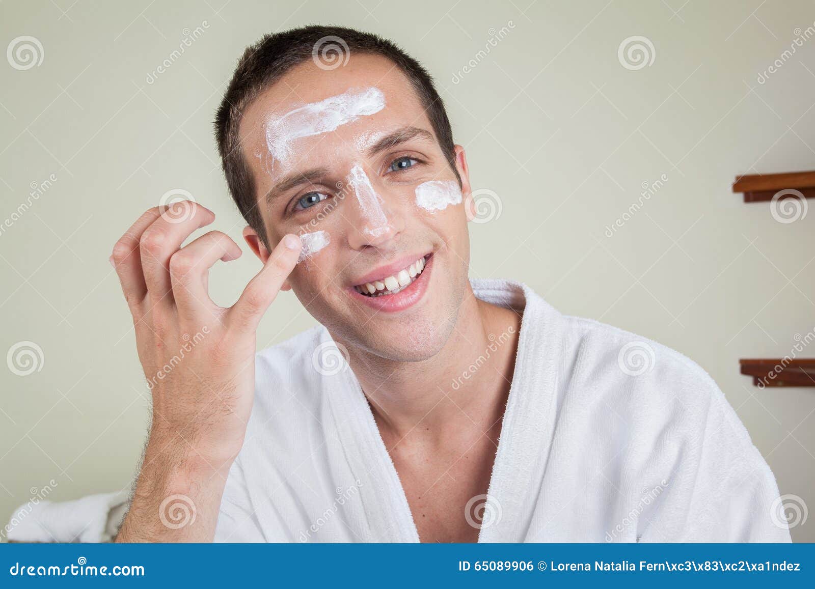 Happy Man Putting on Face Cream Stock Photo - Image of cosmetics ...